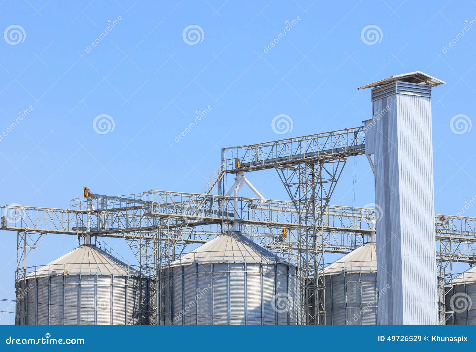 Exterior Structure of New Agriculture Silo Building Against Blue Stock ...
