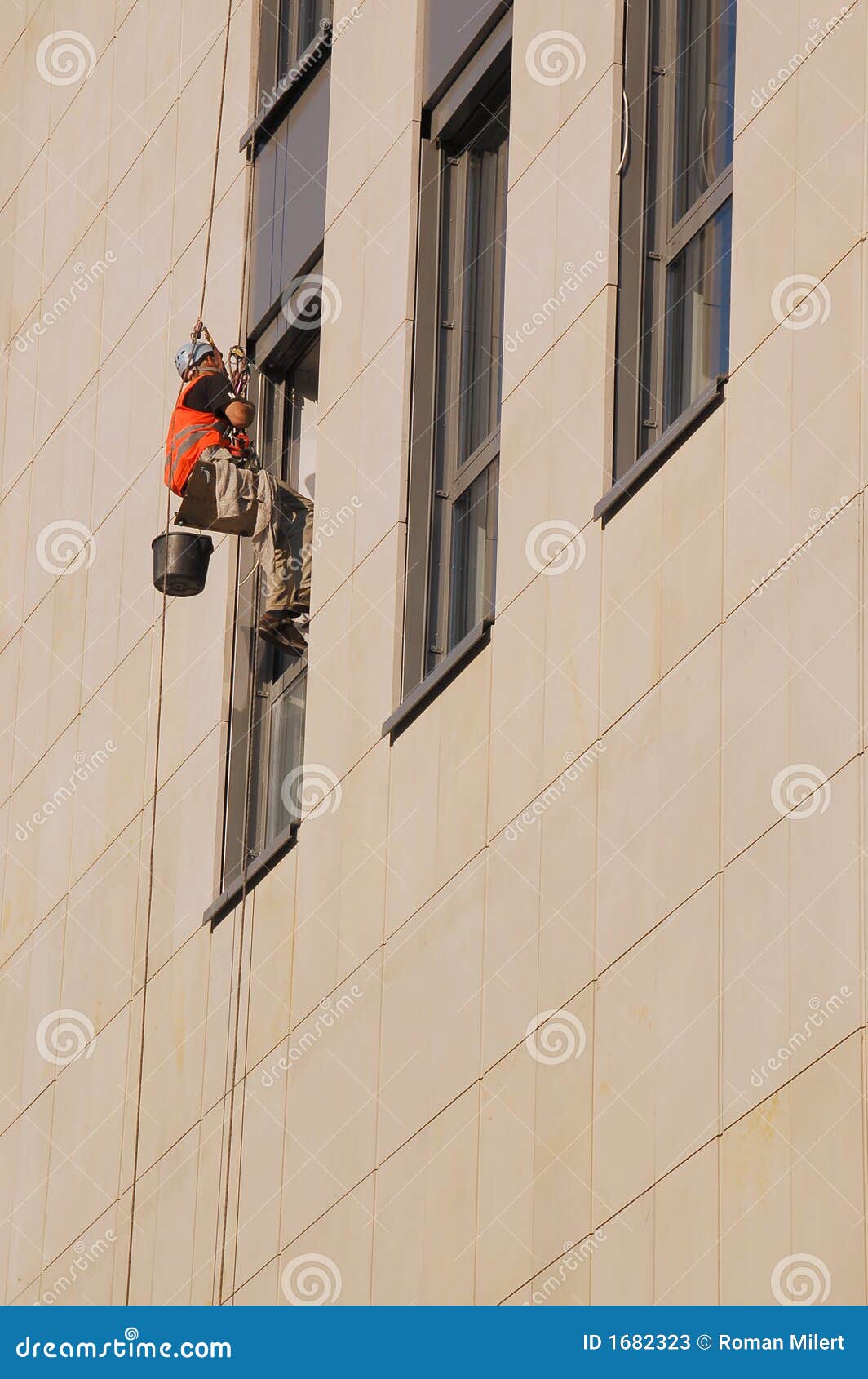 Exterior window washing stock image. Image of climber - 1682323