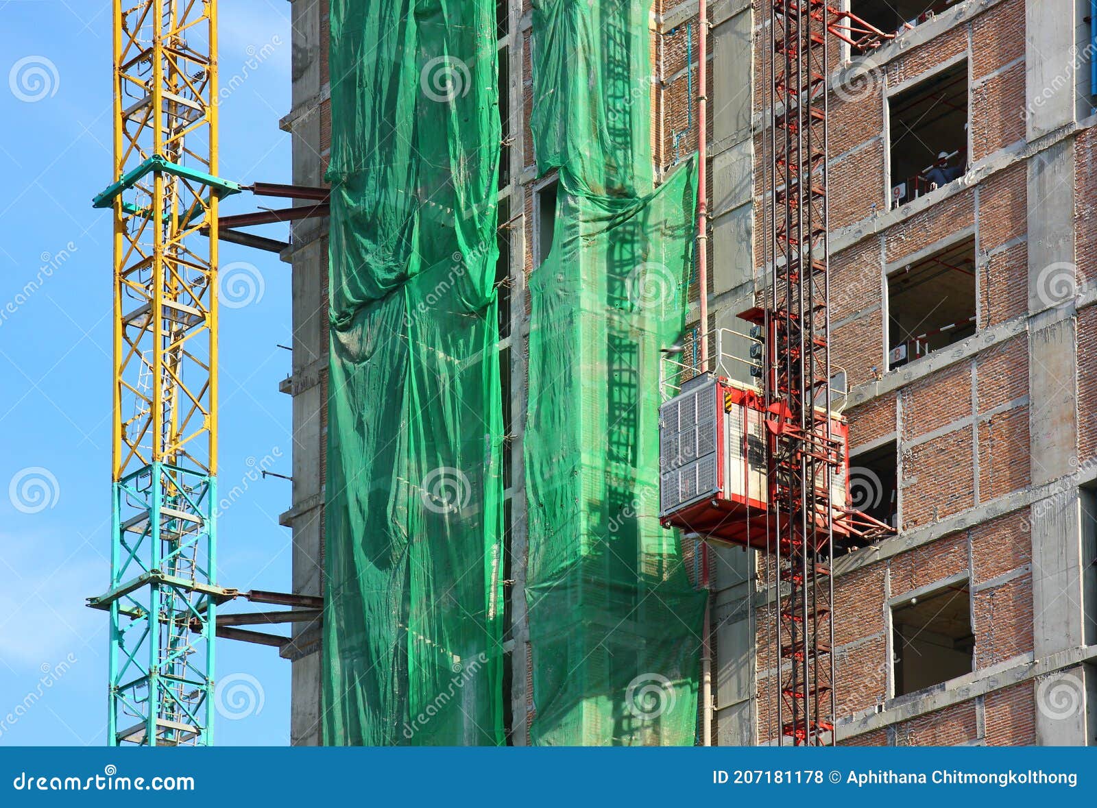 The Exterior Worker Eleavator Install on Building in Construct Stock ...