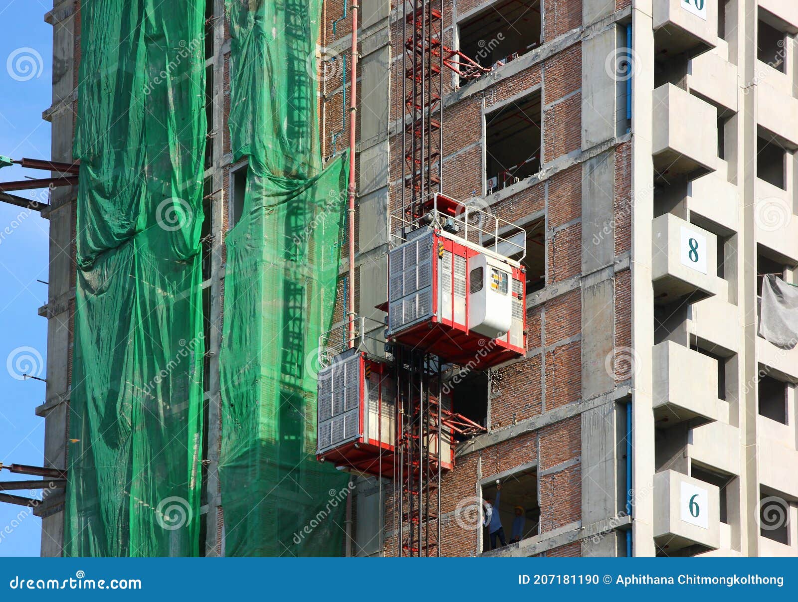 The Exterior Worker Eleavator Install on Building in Construct Stock ...