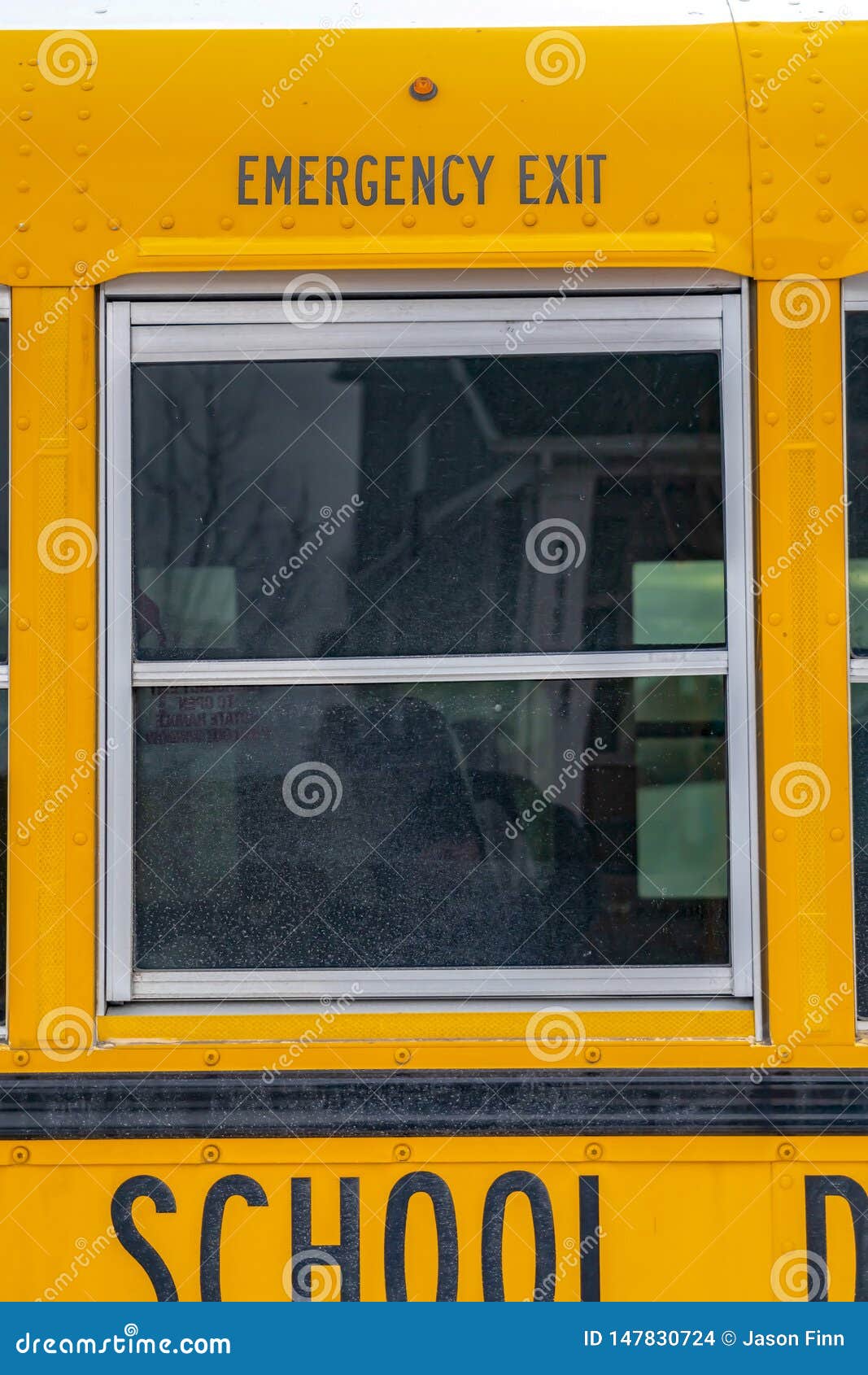 Exterior of a Yellow School Bus with a Close Up View of Its Glass ...