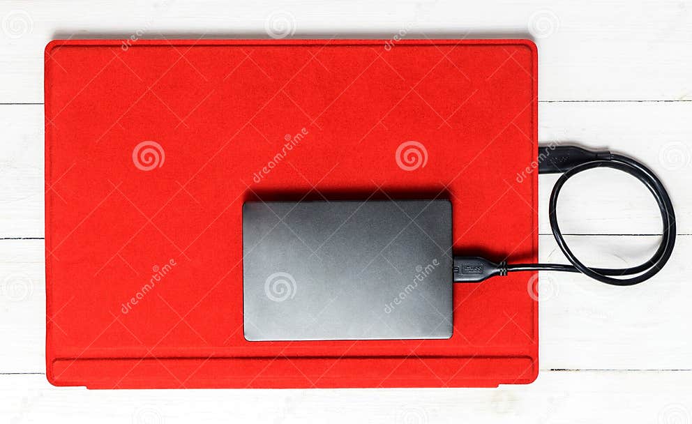 External Hard Disk on Red Tablet Computer Stock Image - Image of table ...
