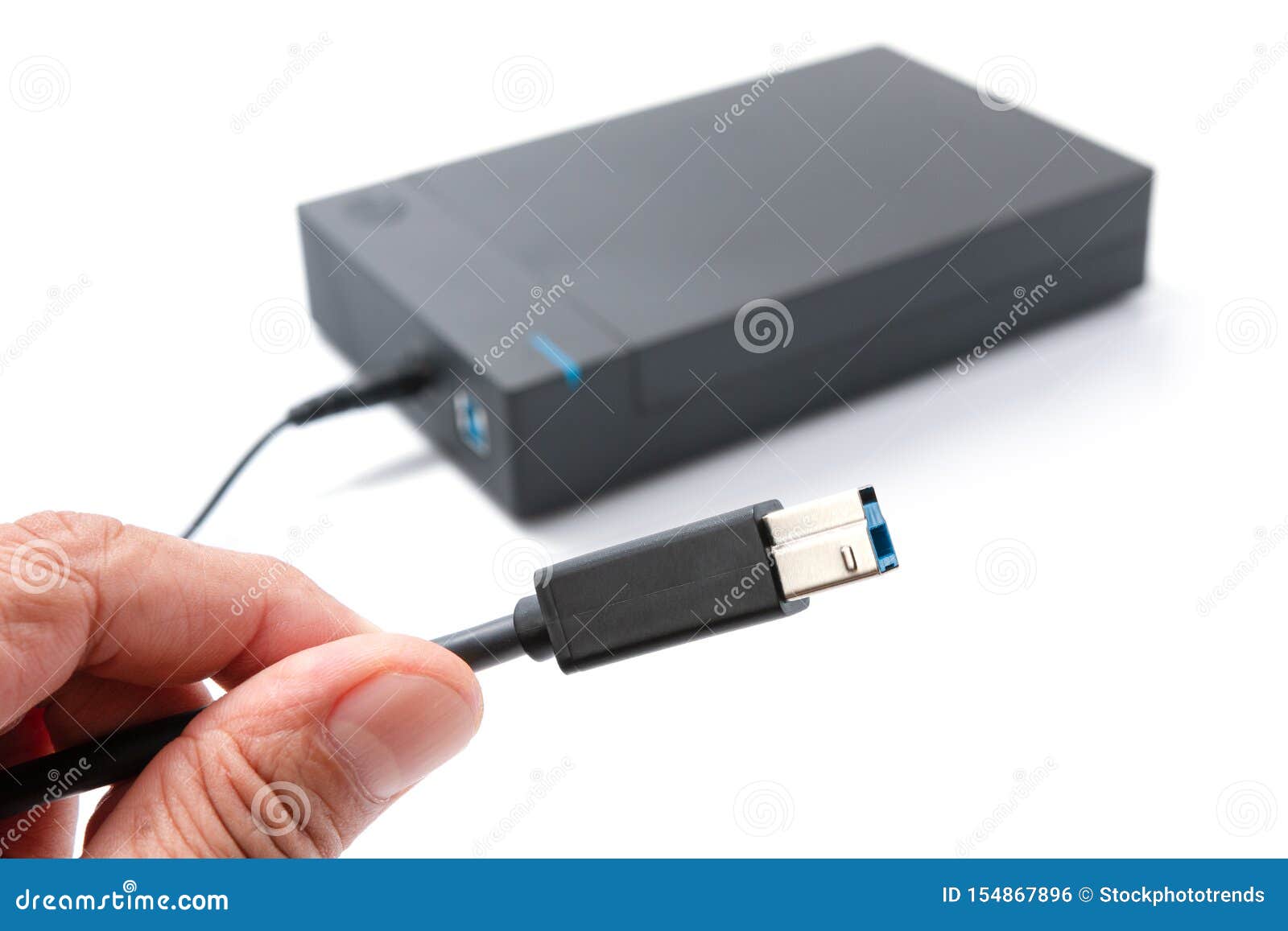 Hand Holding USB Plug, Cable for External Hard Drive Casing Isolated ...