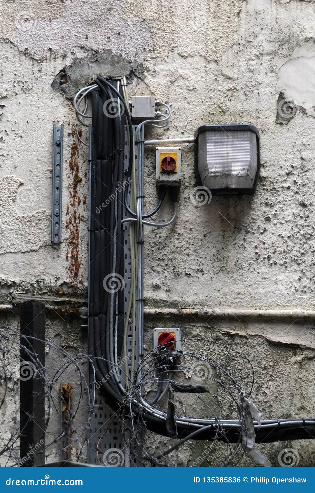External Security Light Mounted on an Old Shabby External Wall with ...