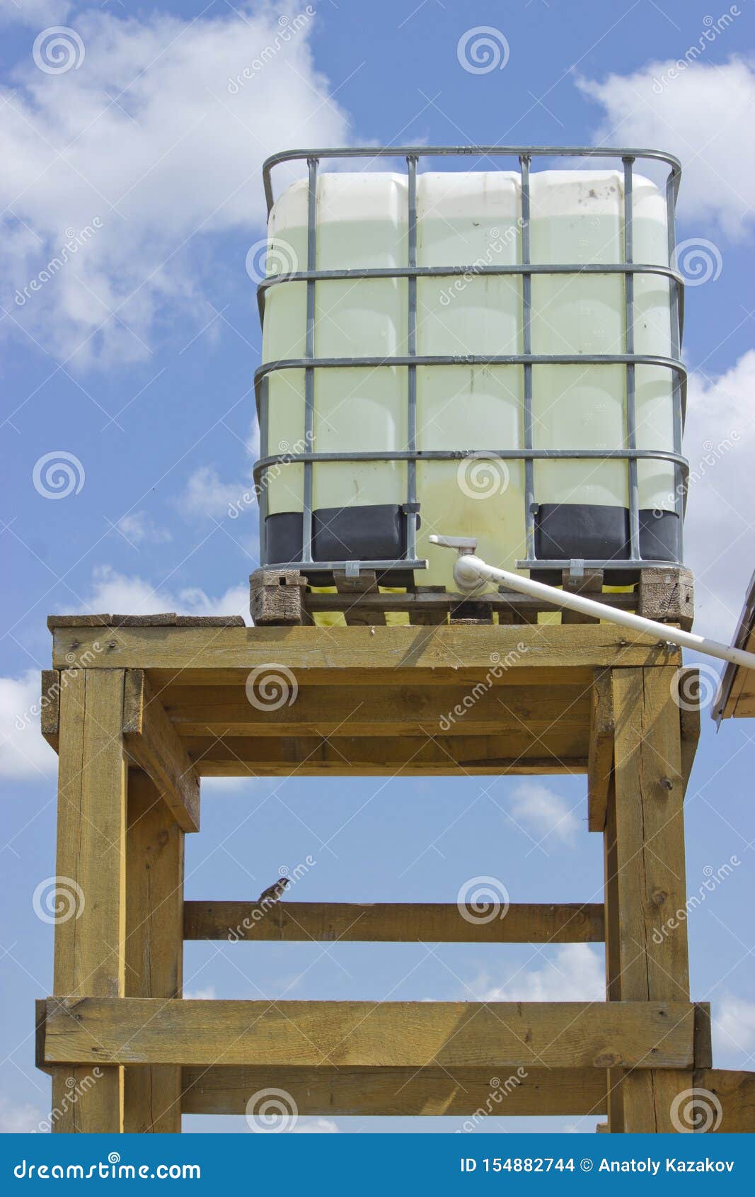 External Water Tank on a Wooden Base, Water is Piped into the House ...