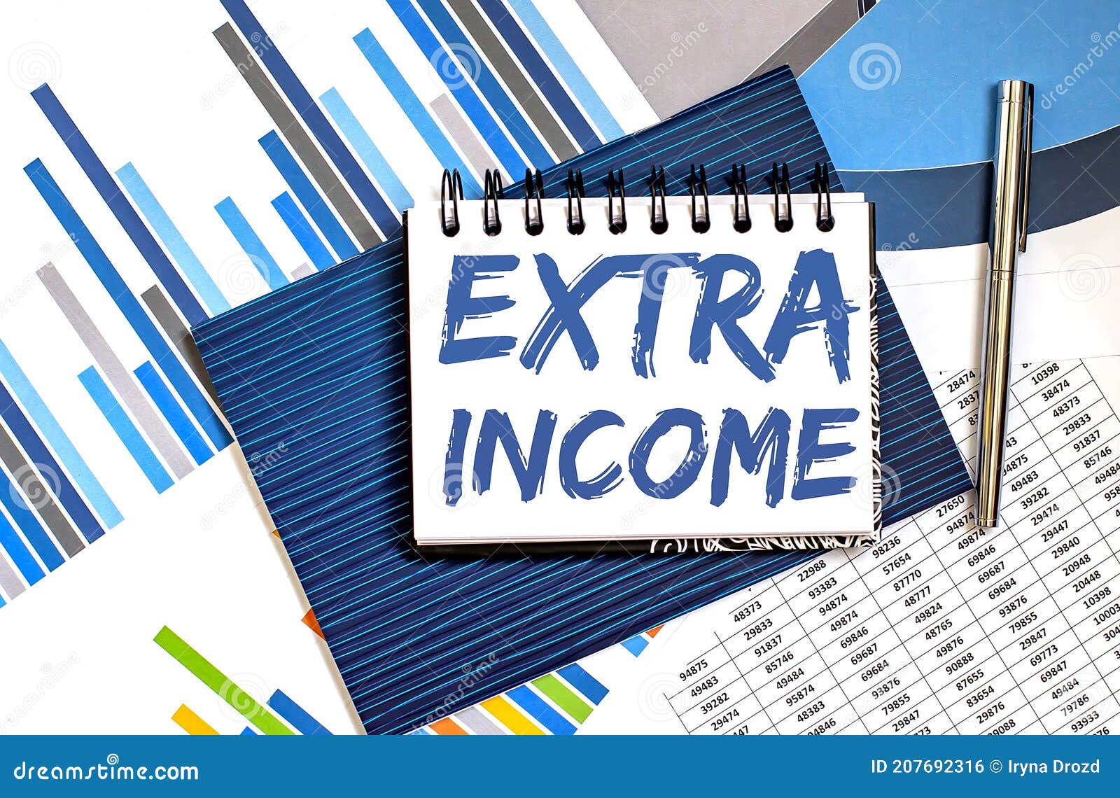 EXTRA INCOME Concepts on the Notepad with Pen and Charts Stock Photo ...