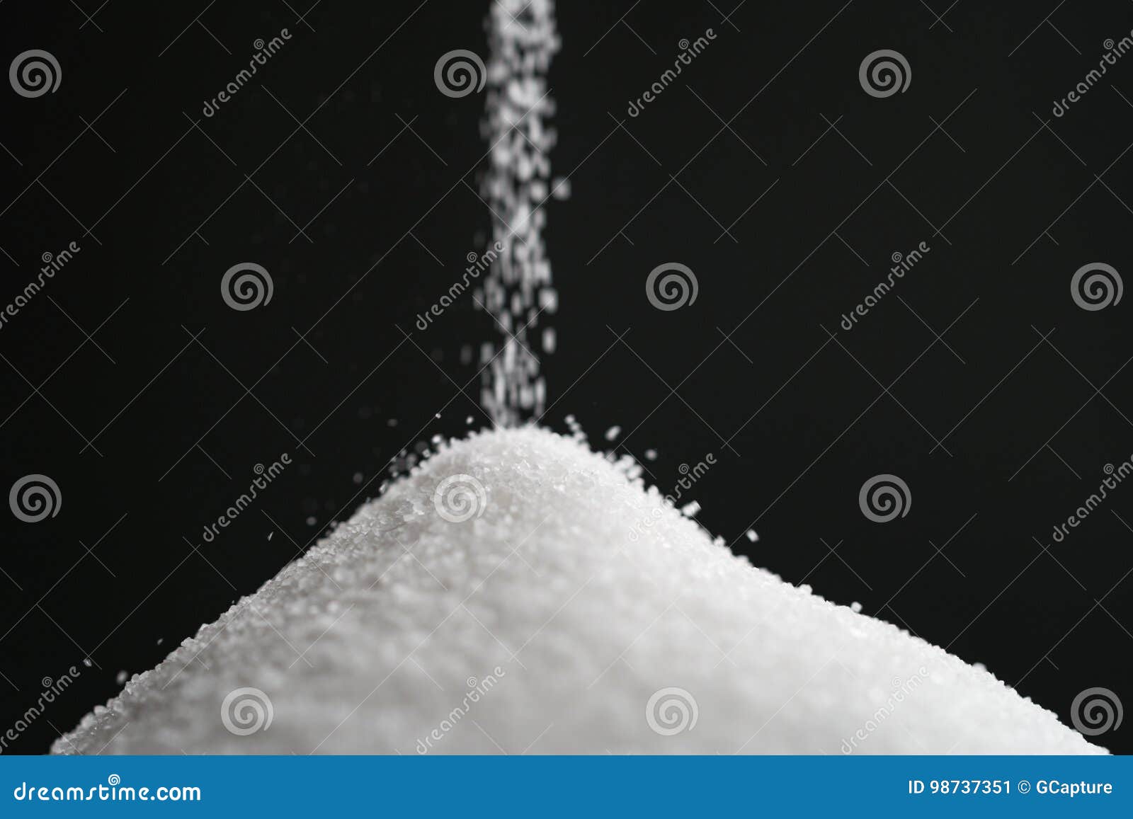 Extra Small Salt Falling on Black Background Stock Image - Image of ...