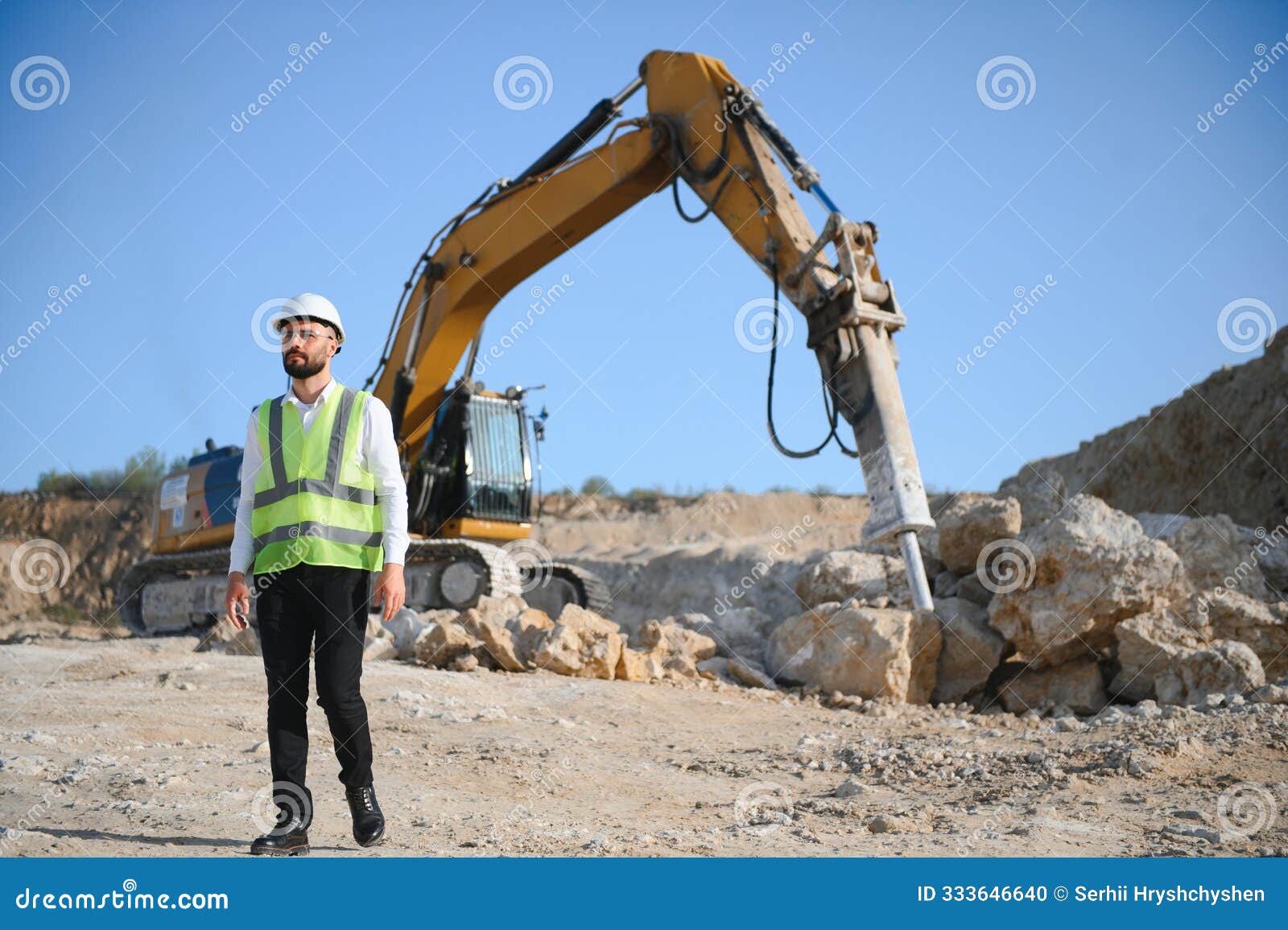 Extraction of Stone. Male Worker Next To Stone Quarry Stock Photo ...