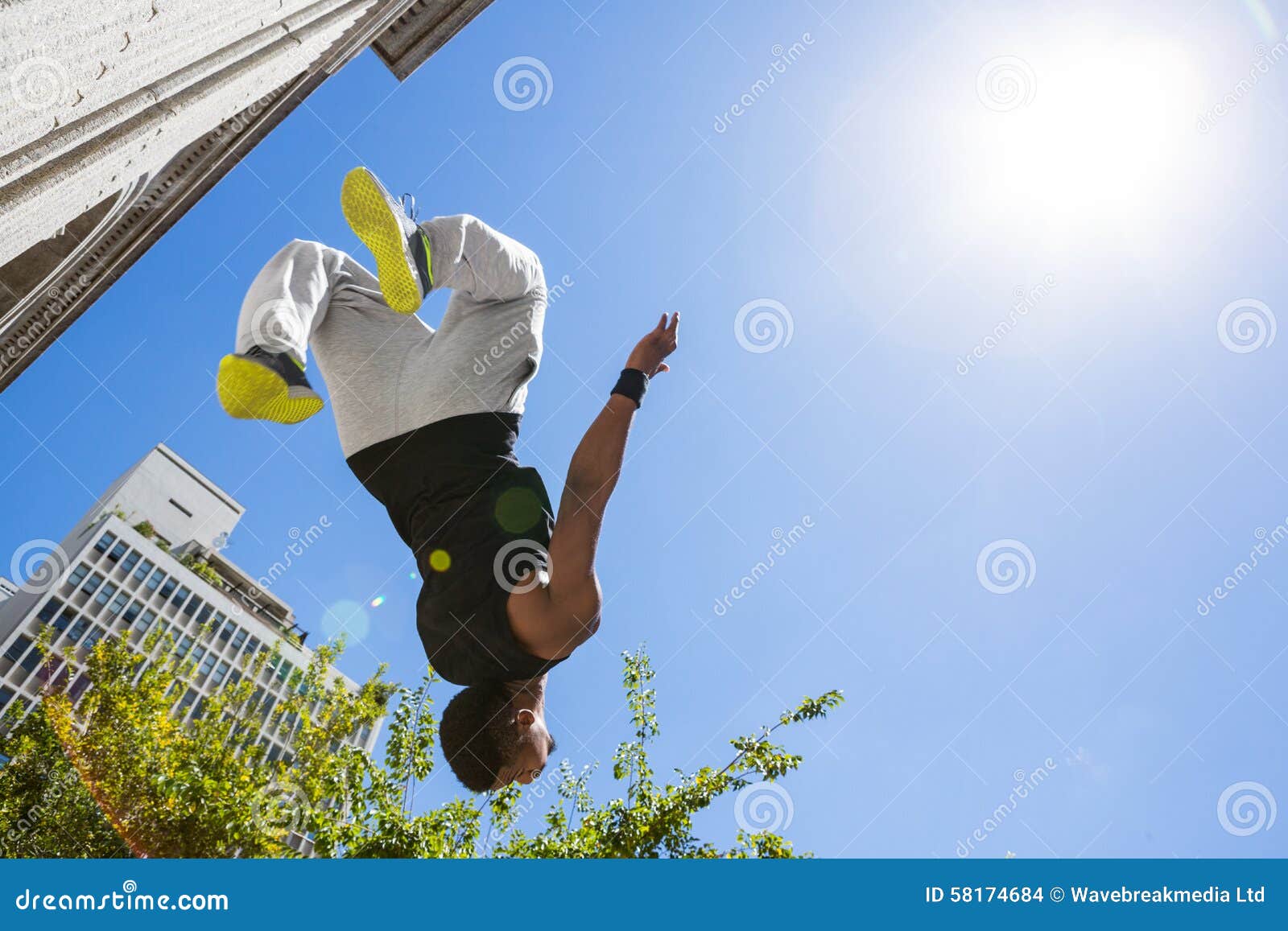 Extreme Athlete Jumping in the Air in Front of a Building Stock Photo ...