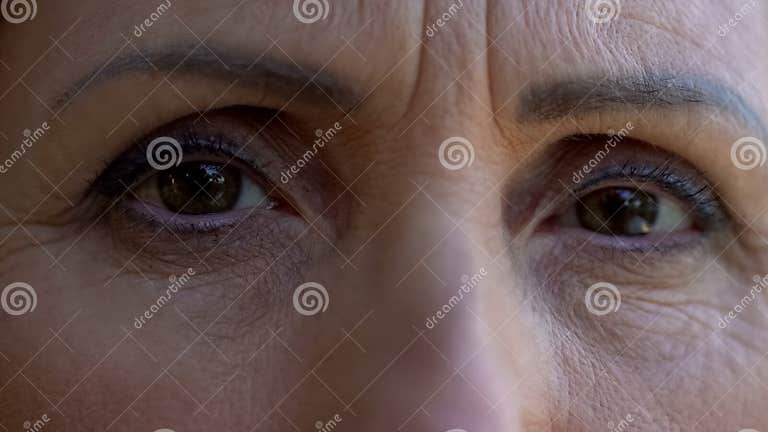 Extreme Close Up Of Mature Woman Eyes Sad Retired Lady Looking Into