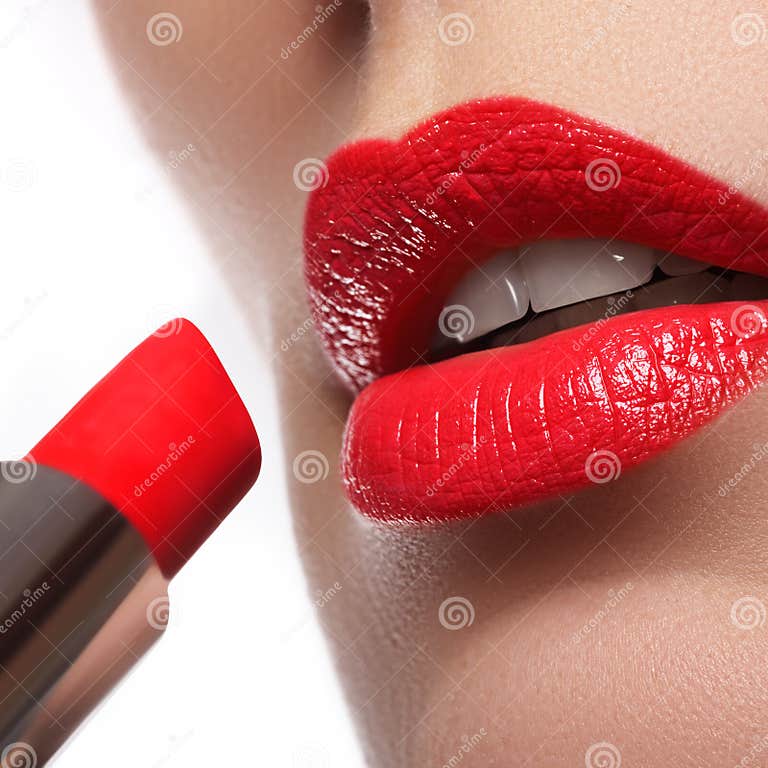 Extreme Close Up On Model Applying Red Lipstick Makeup Professional