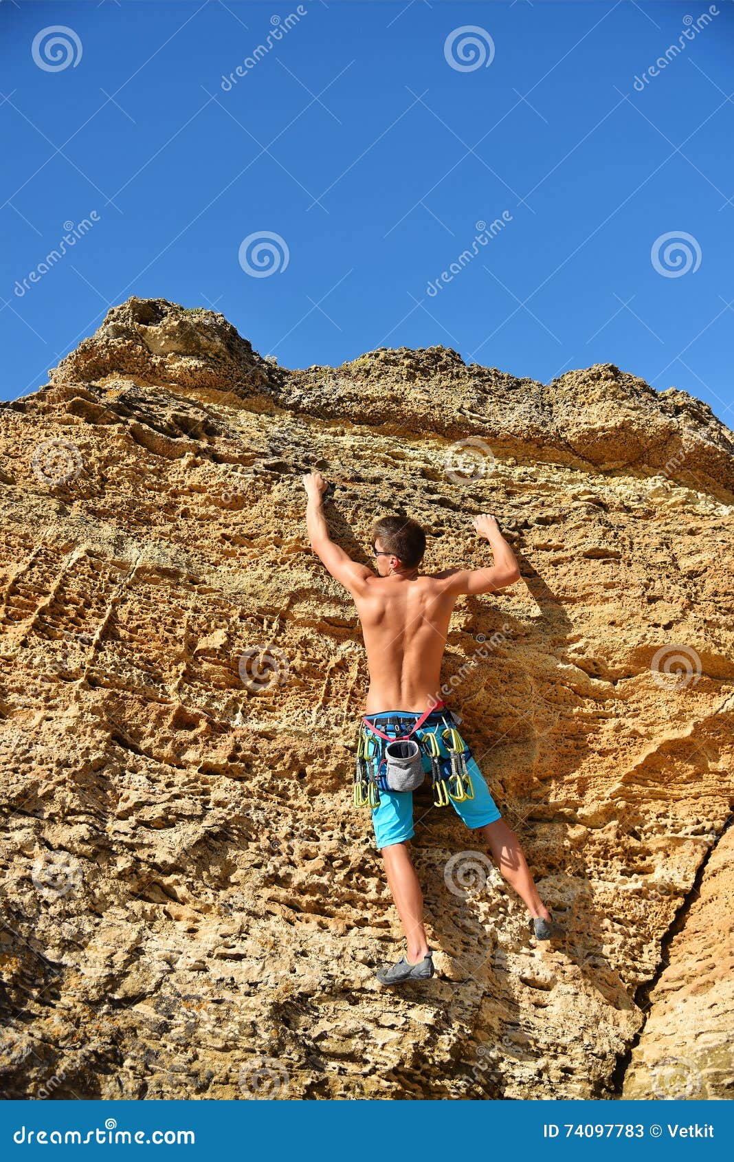 Extreme man climbing up stock image. Image of endurance - 74097783