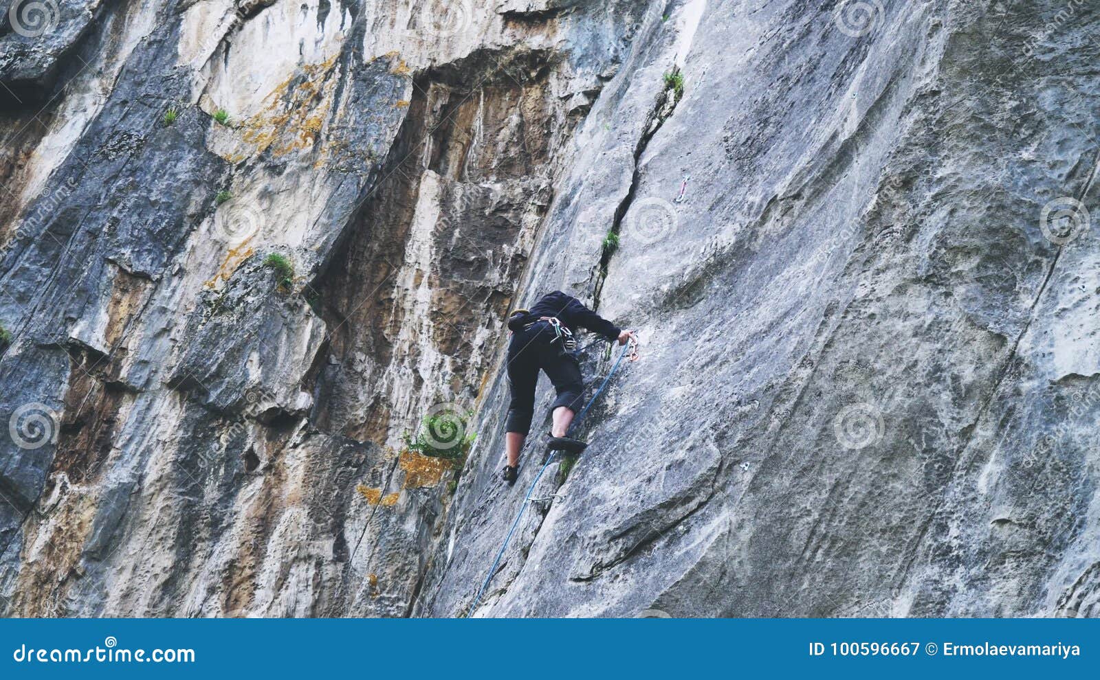 Extreme Rock Climber Climbs Difficult Route in the Mountains Stock ...