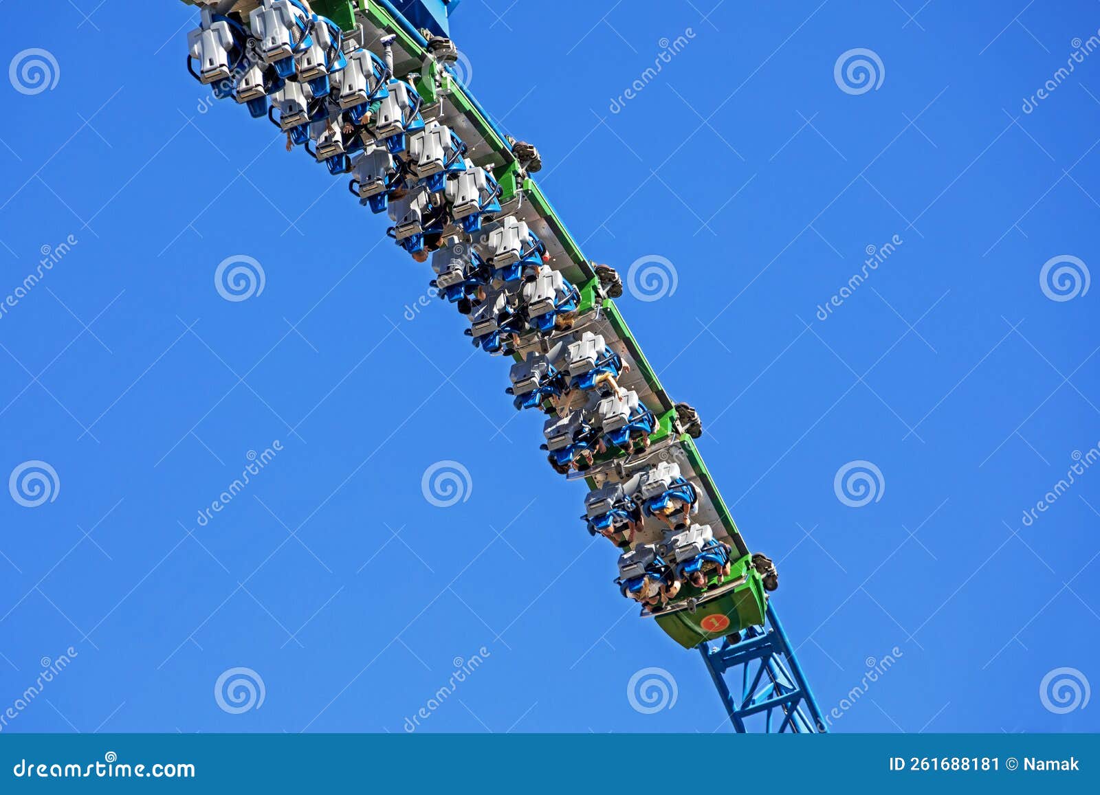Extreme Rollercoaster Upside Down Against the Blue Sky. Attractions ...