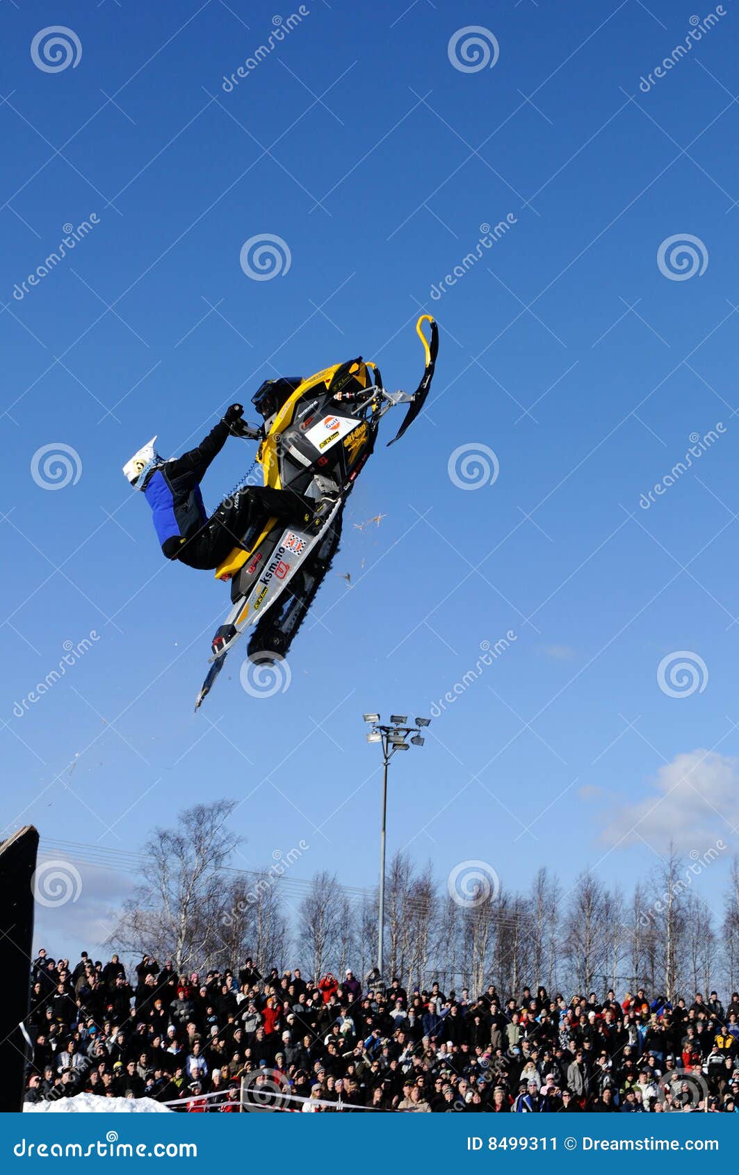 Extreme snowmobile jumping editorial photo. Image of cross - 8499311