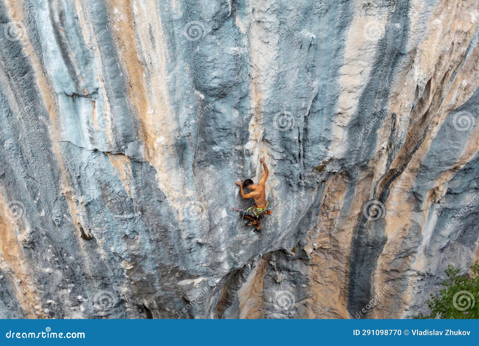Extreme Sport, Strong Man, Rock Climber Climbs a Difficult Route Stock ...