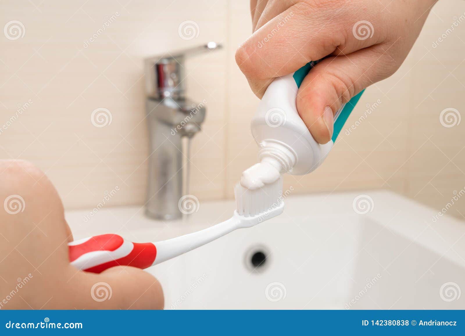 Extrusion of Toothpaste on the Brush in the Bathroom Stock Photo ...