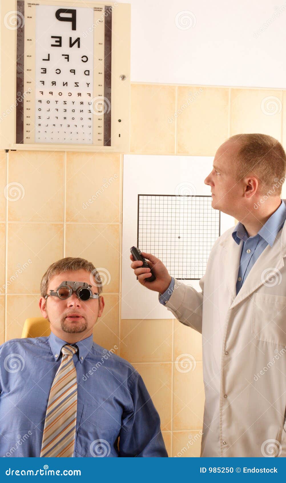 Eye Doctor Performing Eye Examination Stock Photo - Image of optician ...