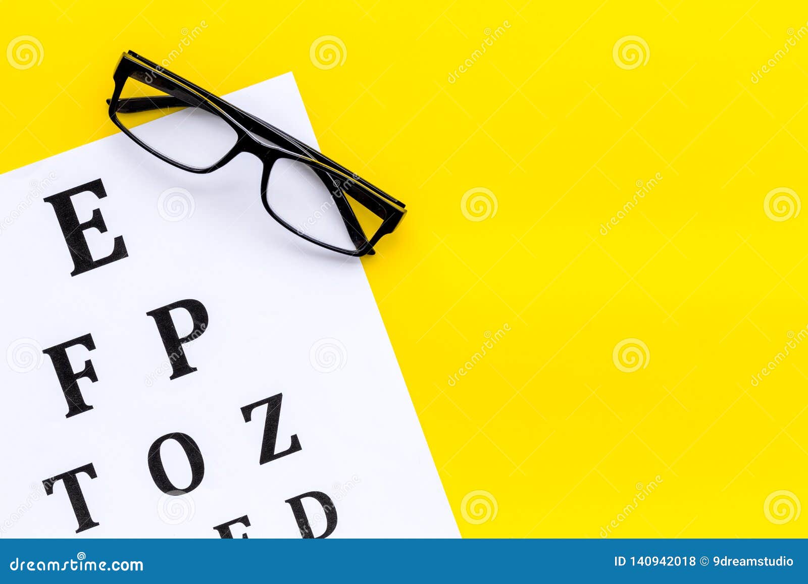 Eye Examination. Eyesight Test Chart and Glasses on Yellow Background ...