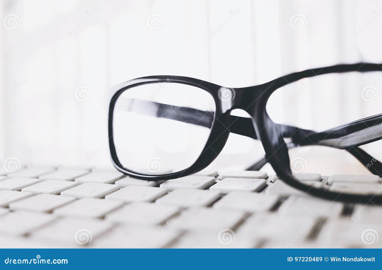 Eye glasses on keyboard stock image. Image of business - 97220489