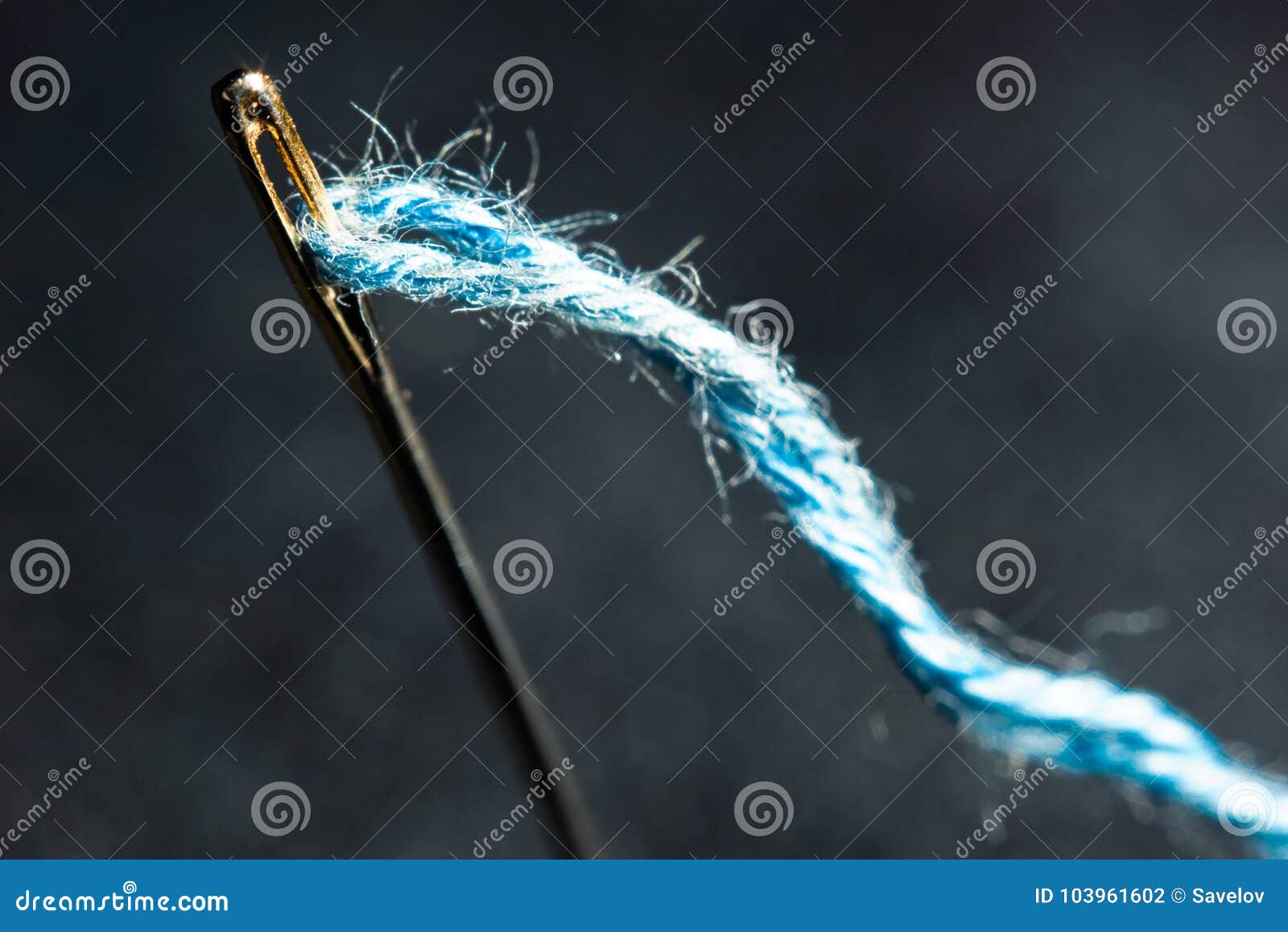 Eye of a Needle with Blue Thread, Macro Stock Photo - Image of cloth ...