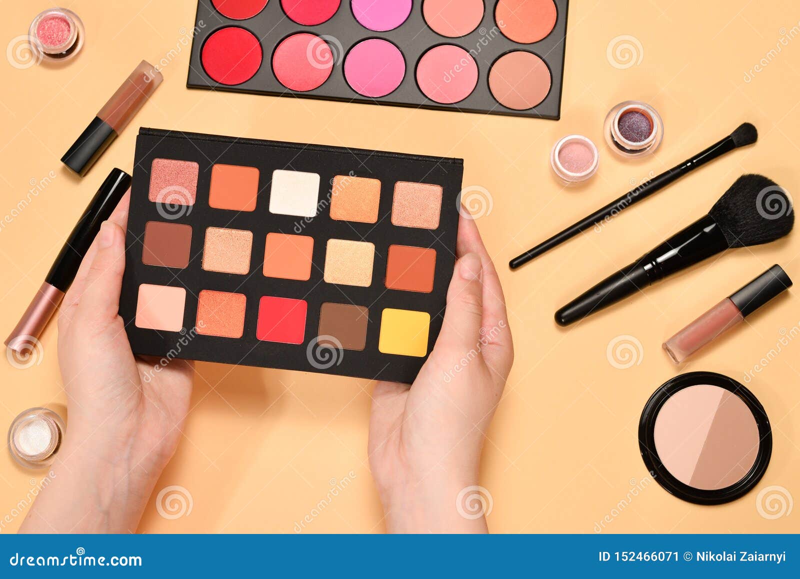 Eye Shadow Palette On Woman Hand Professional Makeup Products With Cosmetic Beauty Products