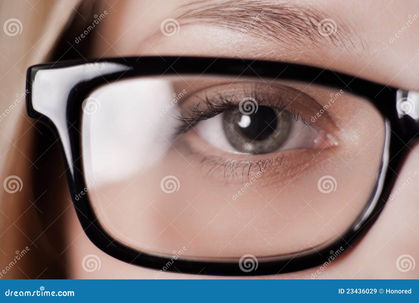 Eye shot through glasses stock image. Image of optics - 23436029