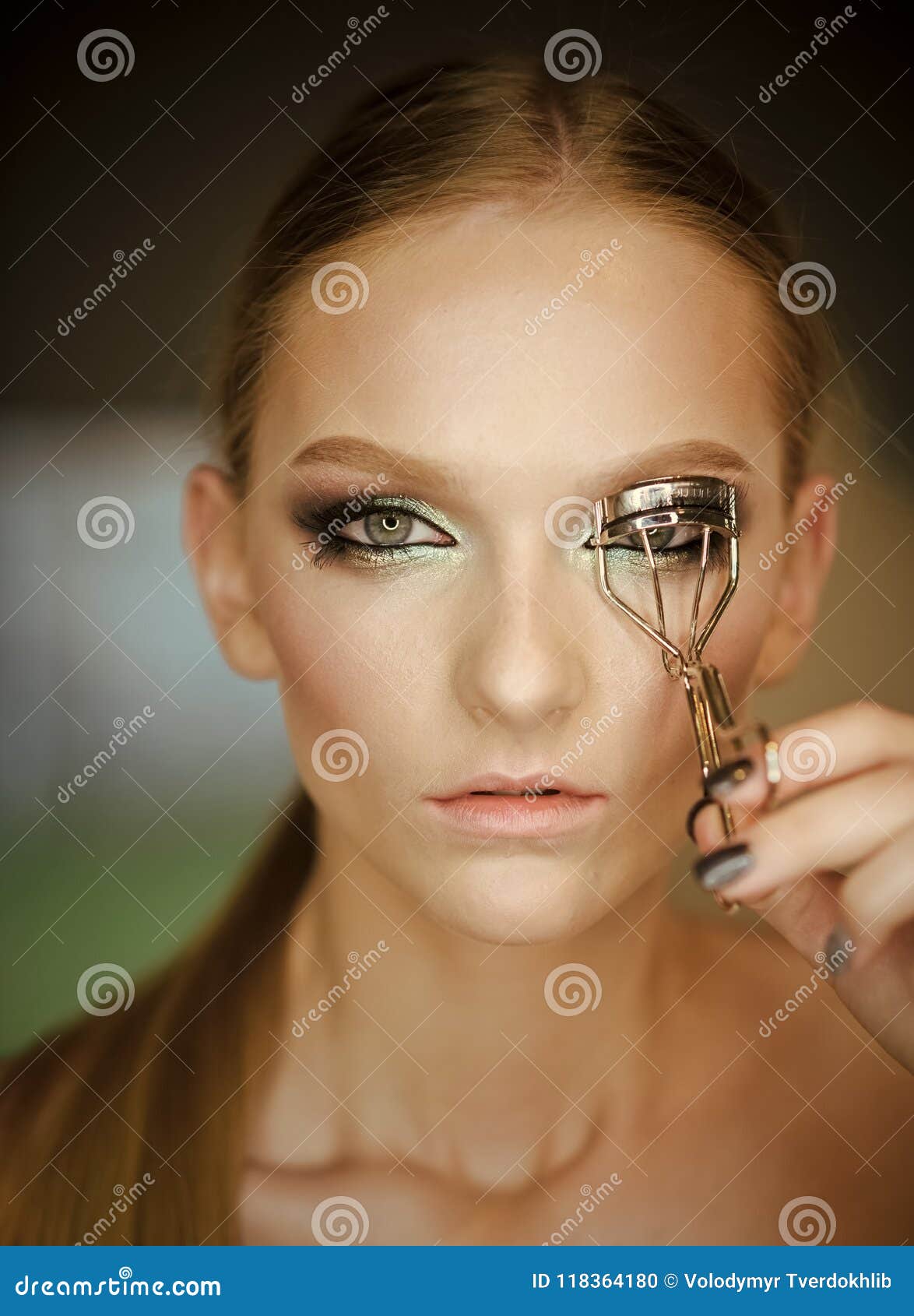 Eyebrow Correction Woman Corrects Eyelashes With Curling Tongs