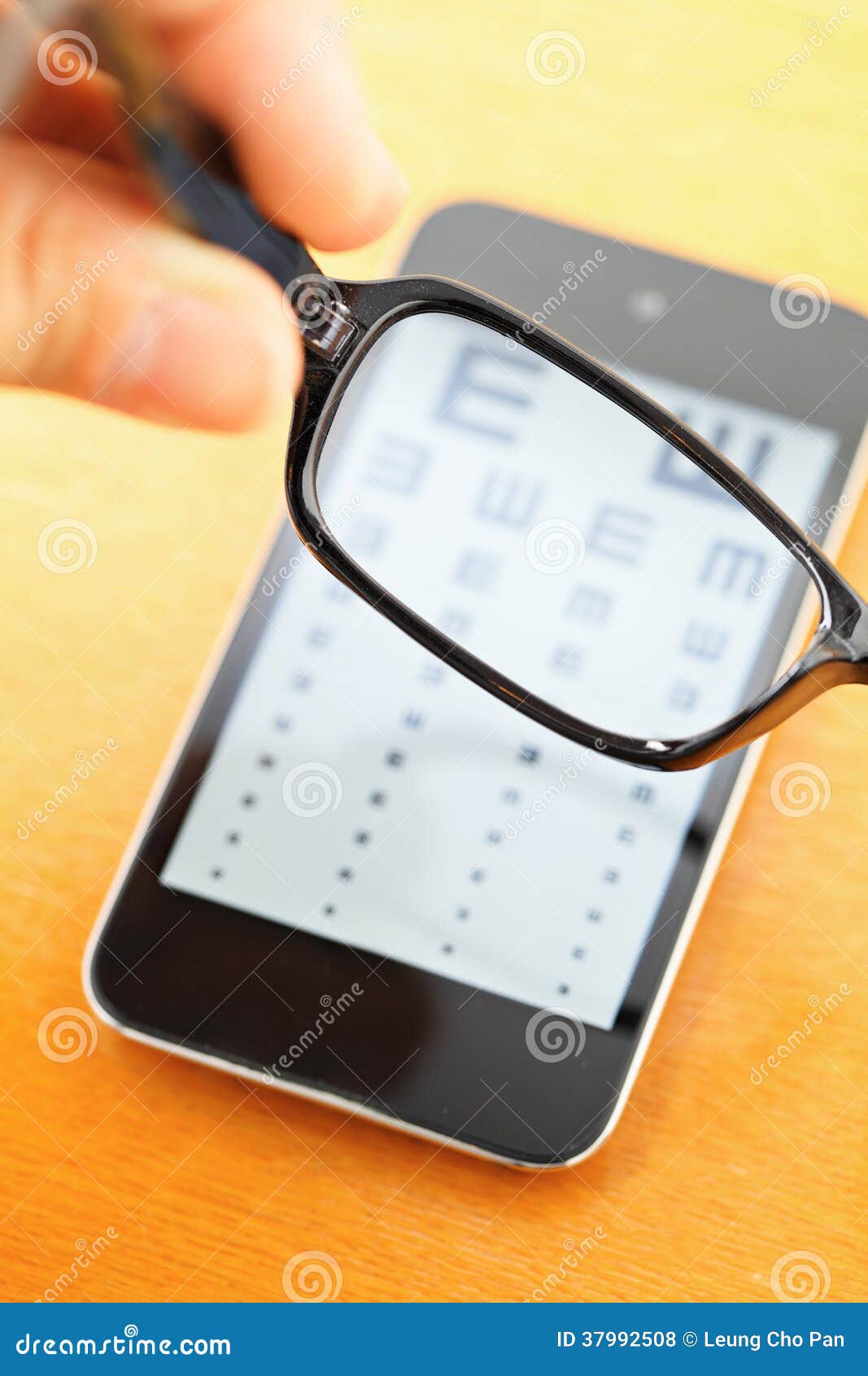 Eyechart on Mobile Screen with Eyewear Stock Photo - Image of holding ...