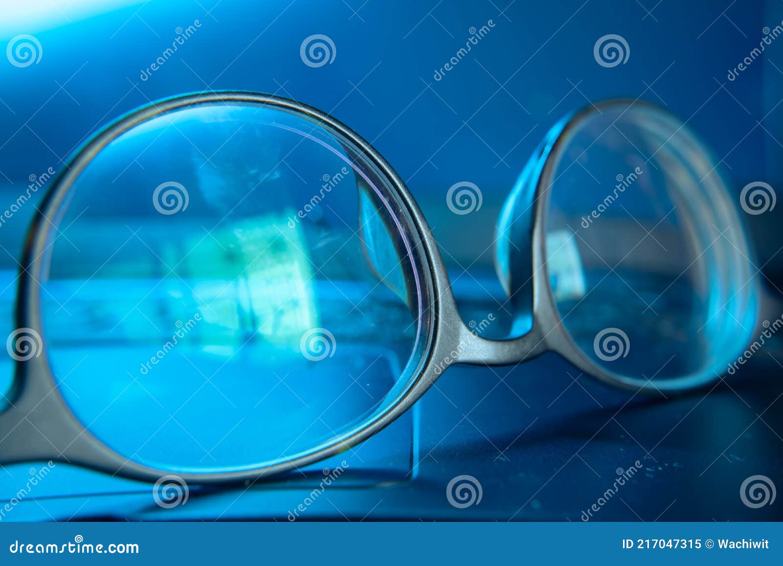 Eyeglasses in Blue Light from Computer Screen Stock Image - Image of ...