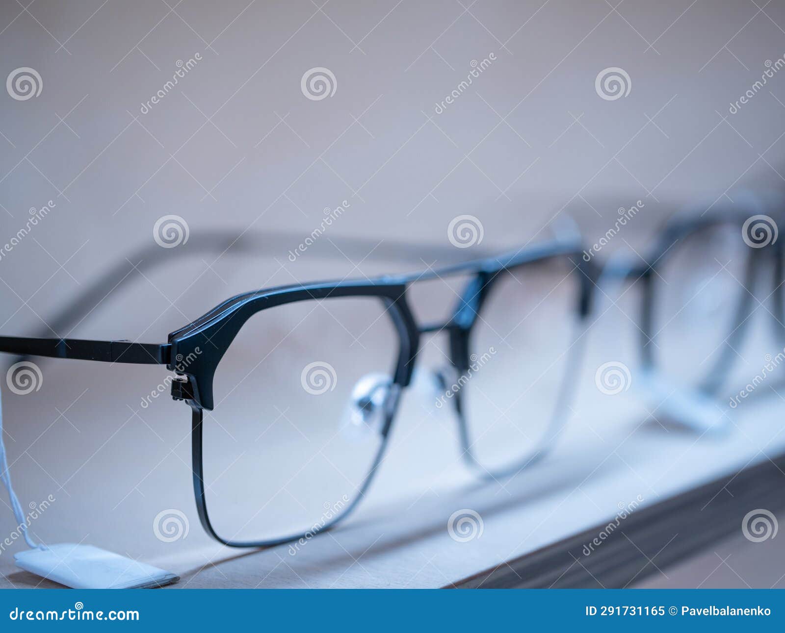 Eyeglasses on a shelf stock image. Image of eyeglasses - 291731165