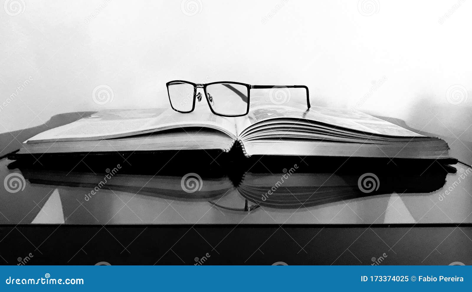 Eyeglasses on Top of an Open Book Stock Image - Image of eyeglasses ...