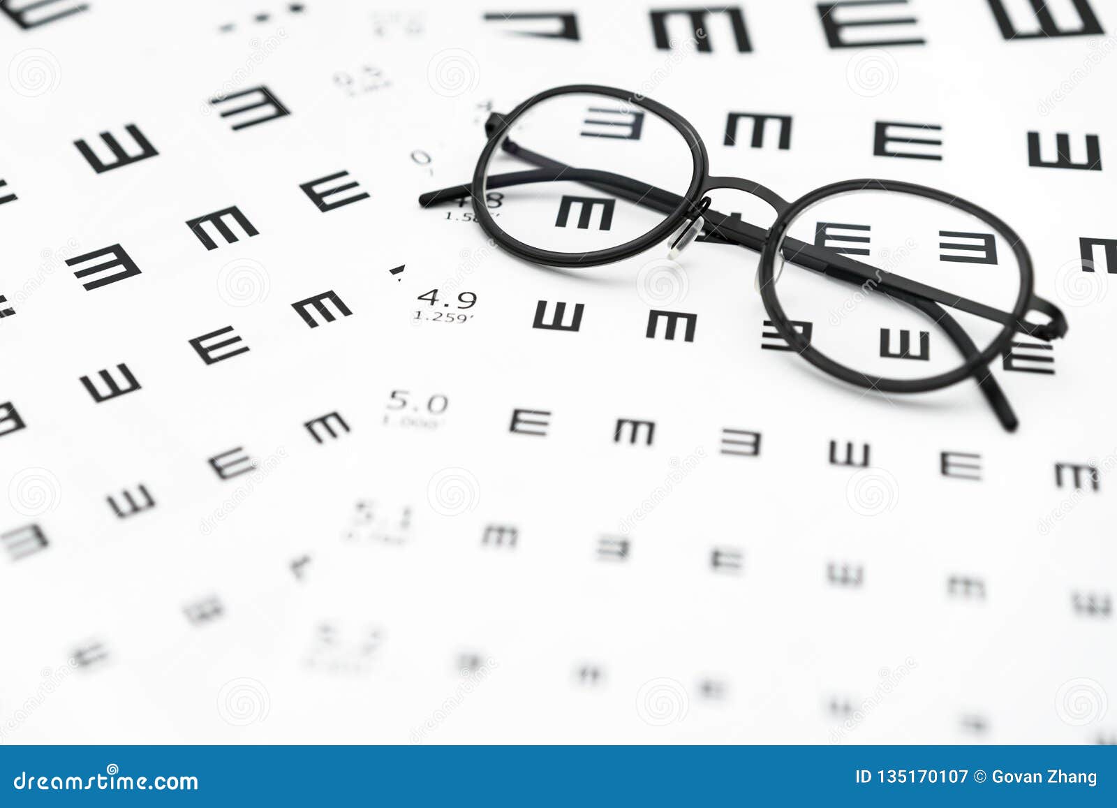 Eyeglasses and Visual Acuity Chart in White Background Stock Image ...