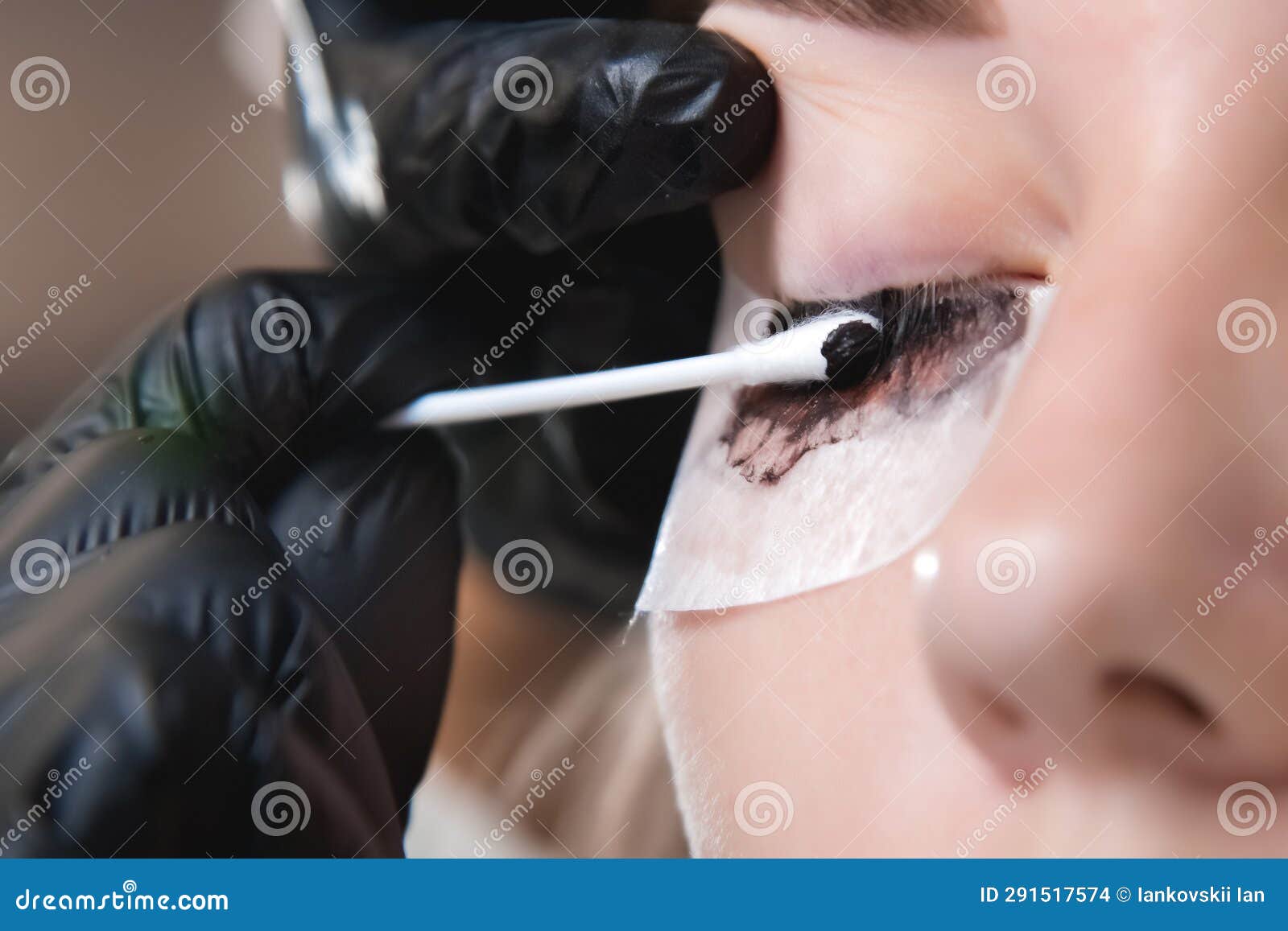 Eyelash Procedure with Master and Client in a Beauty Salon. Close-up of ...