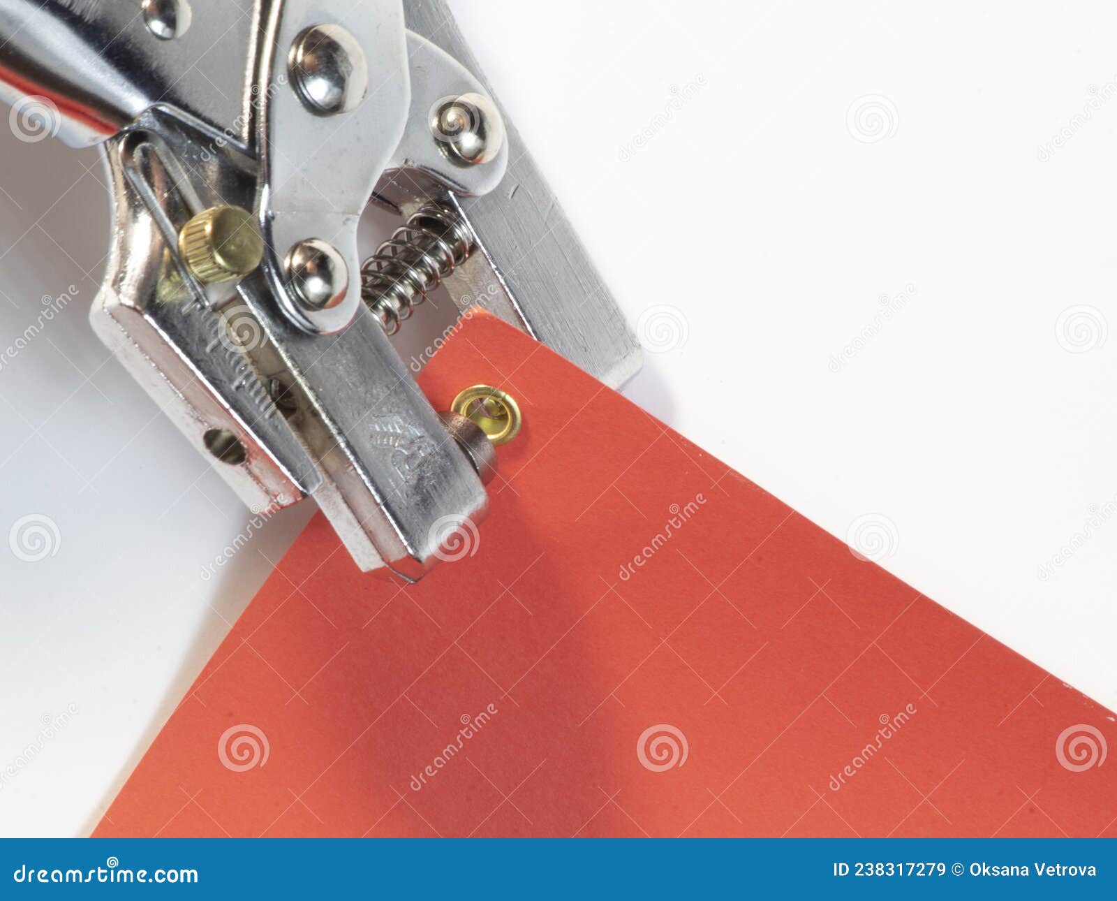 Eyelet Installer in Action on Paper Stock Image - Image of hole ...