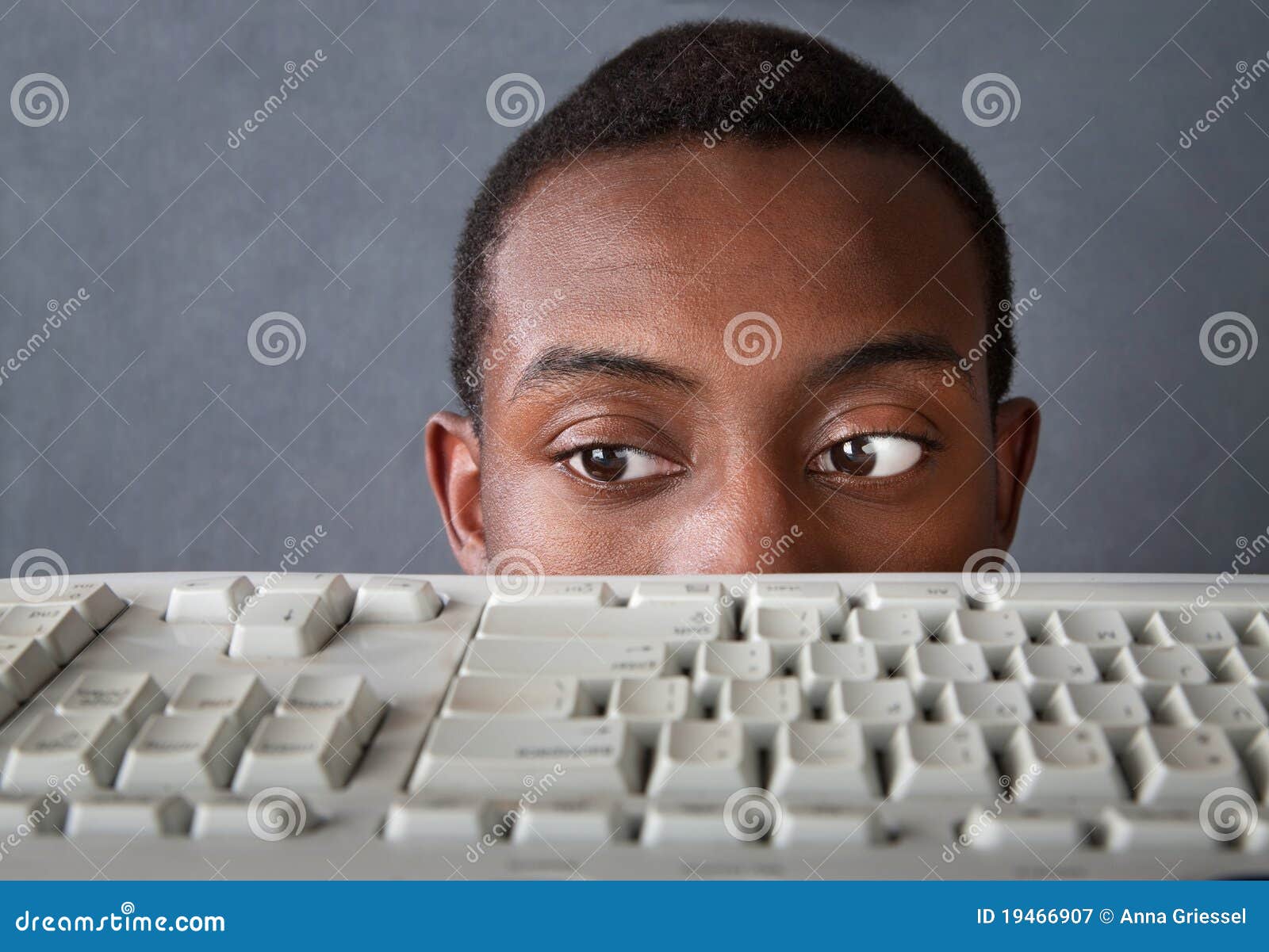 Eyes of Man Above Keyboard stock image. Image of overview - 19466907