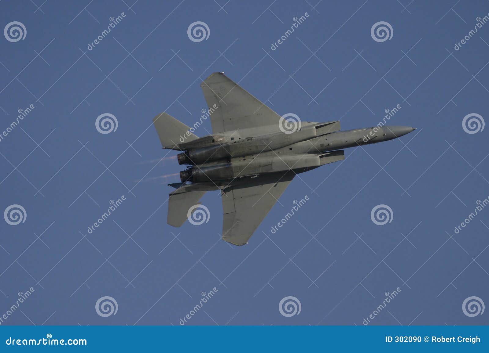 F-15 in flight from bottom stock photo. Image of fighter - 302090