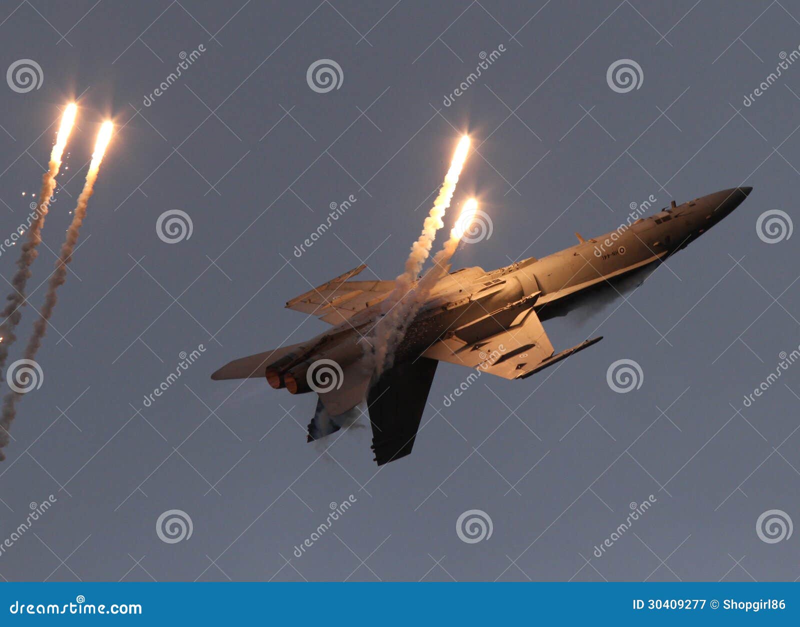 F-18 on back with flares editorial photography. Image of back - 30409277