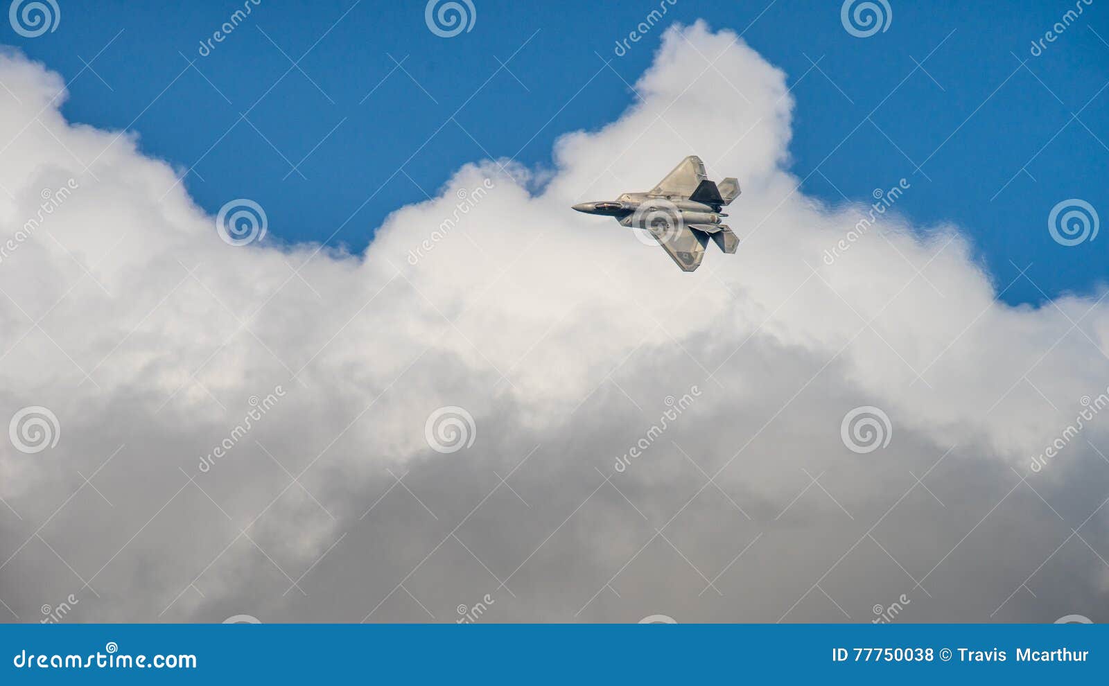 F-22 Raptor in the clouds stock photo. Image of view - 77750038