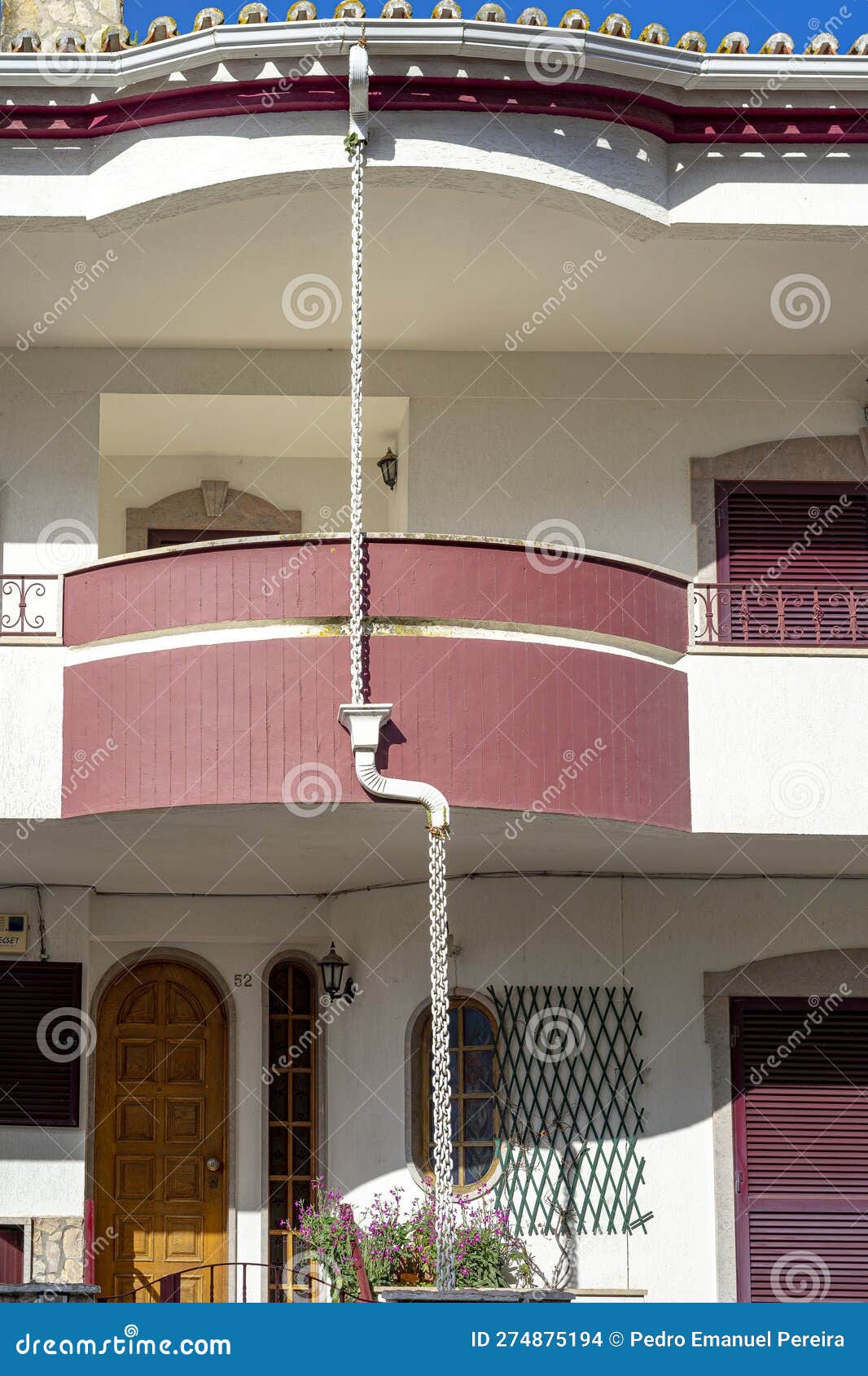 Façade of a House with a Metallic Chain in the Rainwater Drainage ...