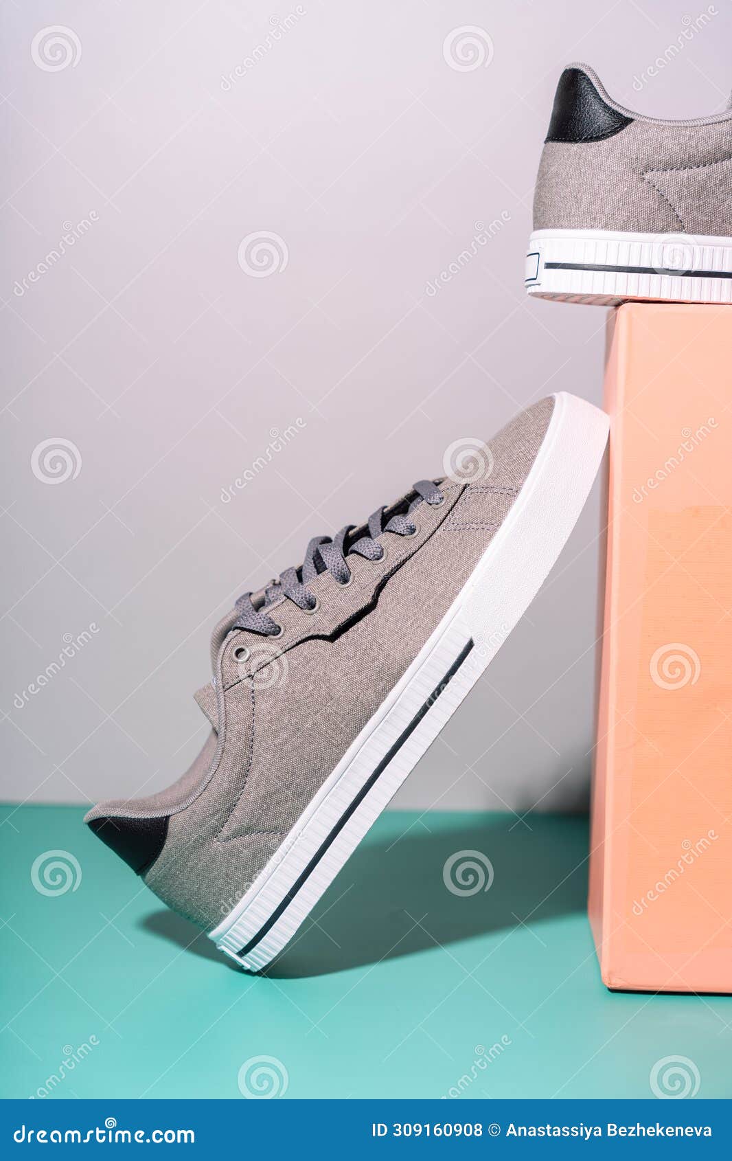 Fabric Gray Sneakers with Rubber White Soles in Front of a Box Stock ...