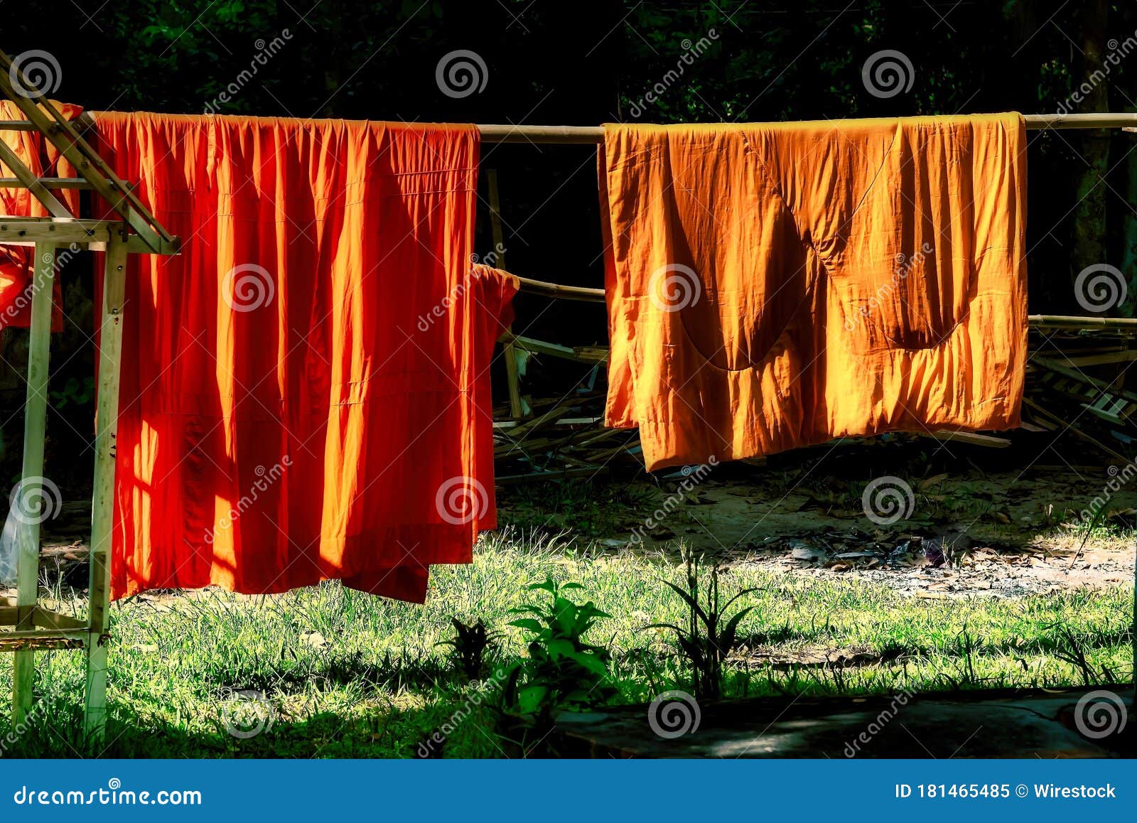 Fabrics Hanging on a Wooden Pole Stock Image - Image of cloth, chores ...