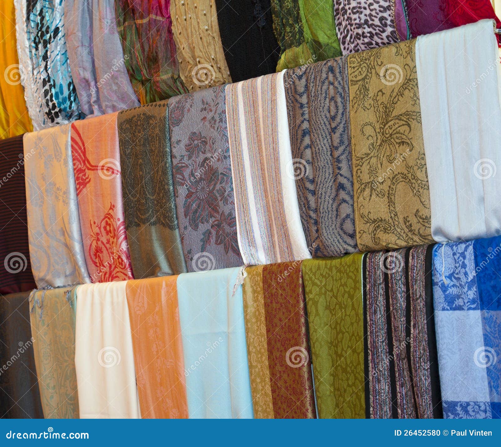 Fabrics at a market stall stock photo. Image of texture - 26452580