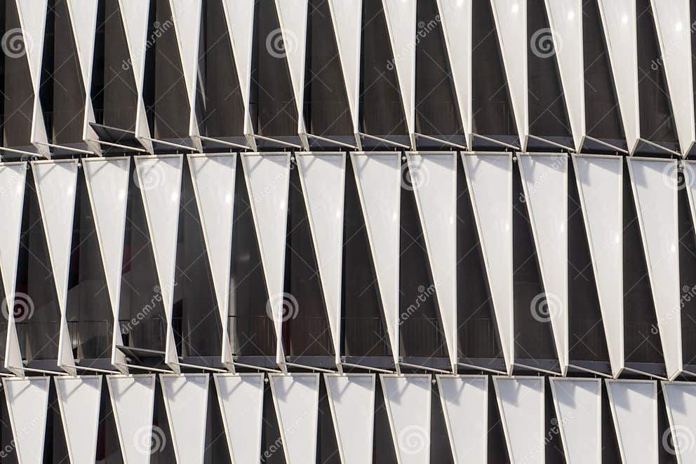 Facade with Alternating Dark and Light Triangular Shapes Creating a ...