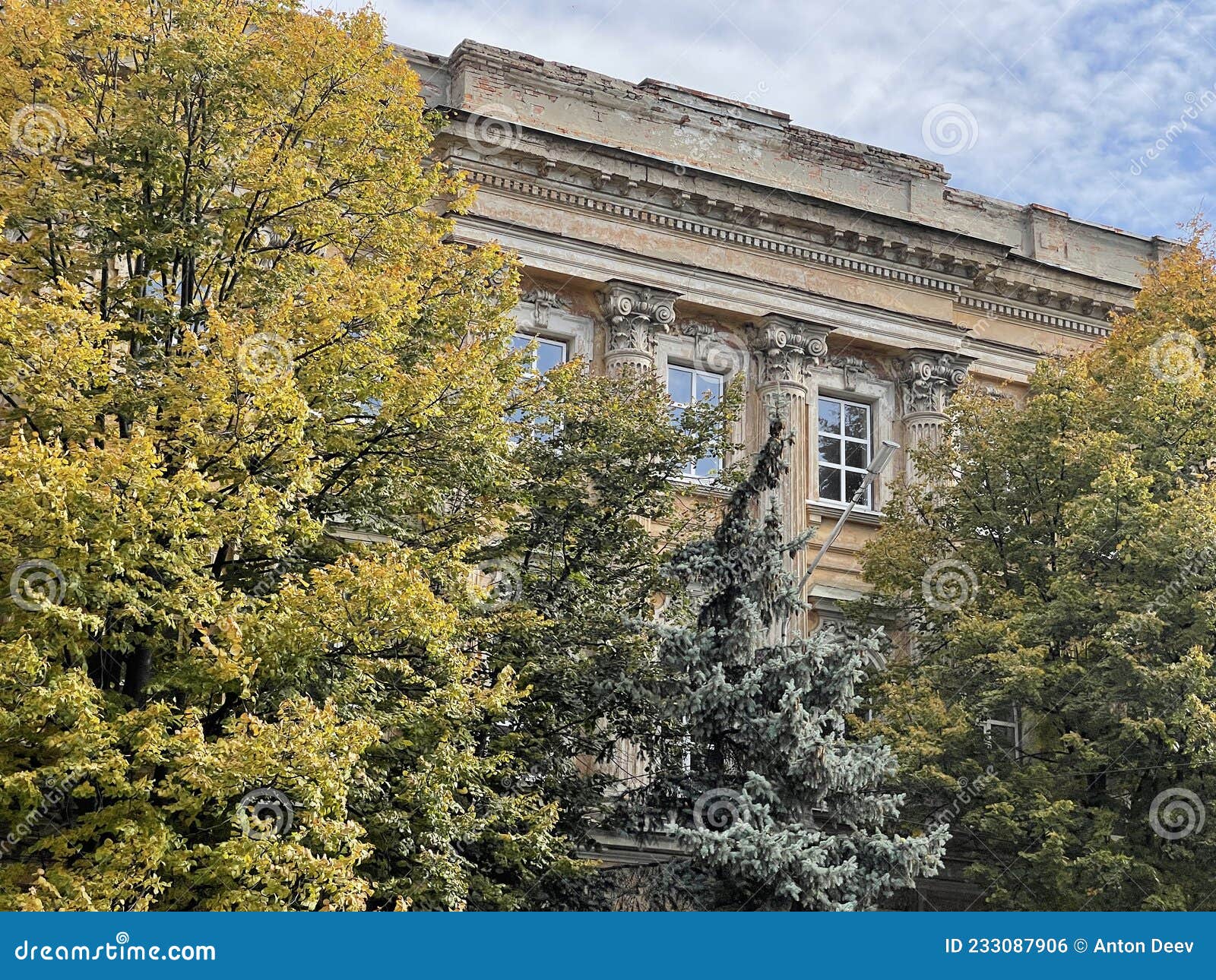 Facade Of Architectural Building Surrounded By Trees Shabby Historic