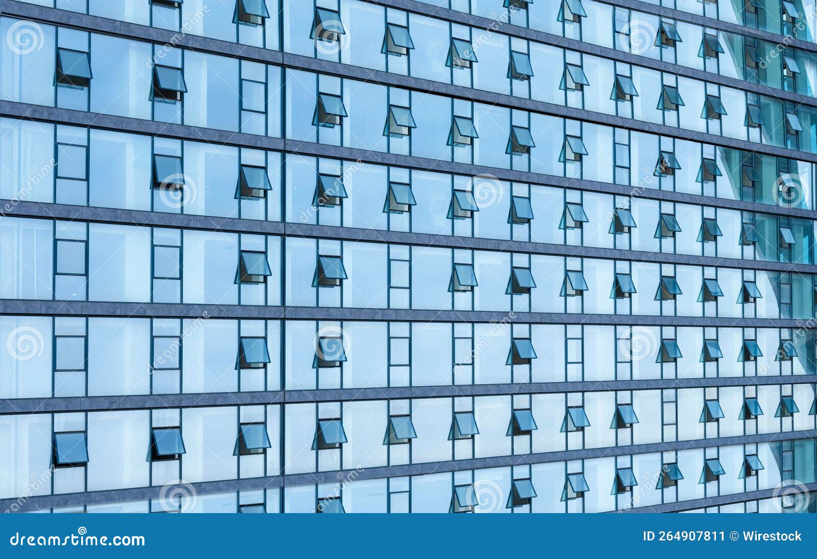 Facade of a Blue Glass Office Building with Open Windows and Steel ...