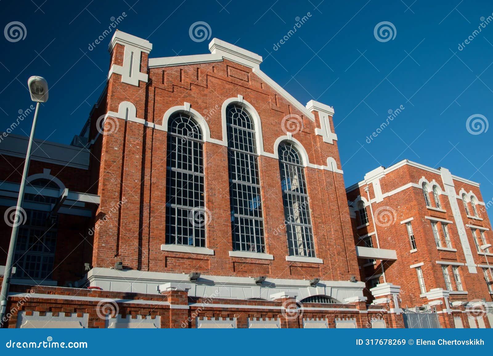 Facade of a Brick Building with Large Windows Stock Image - Image of ...