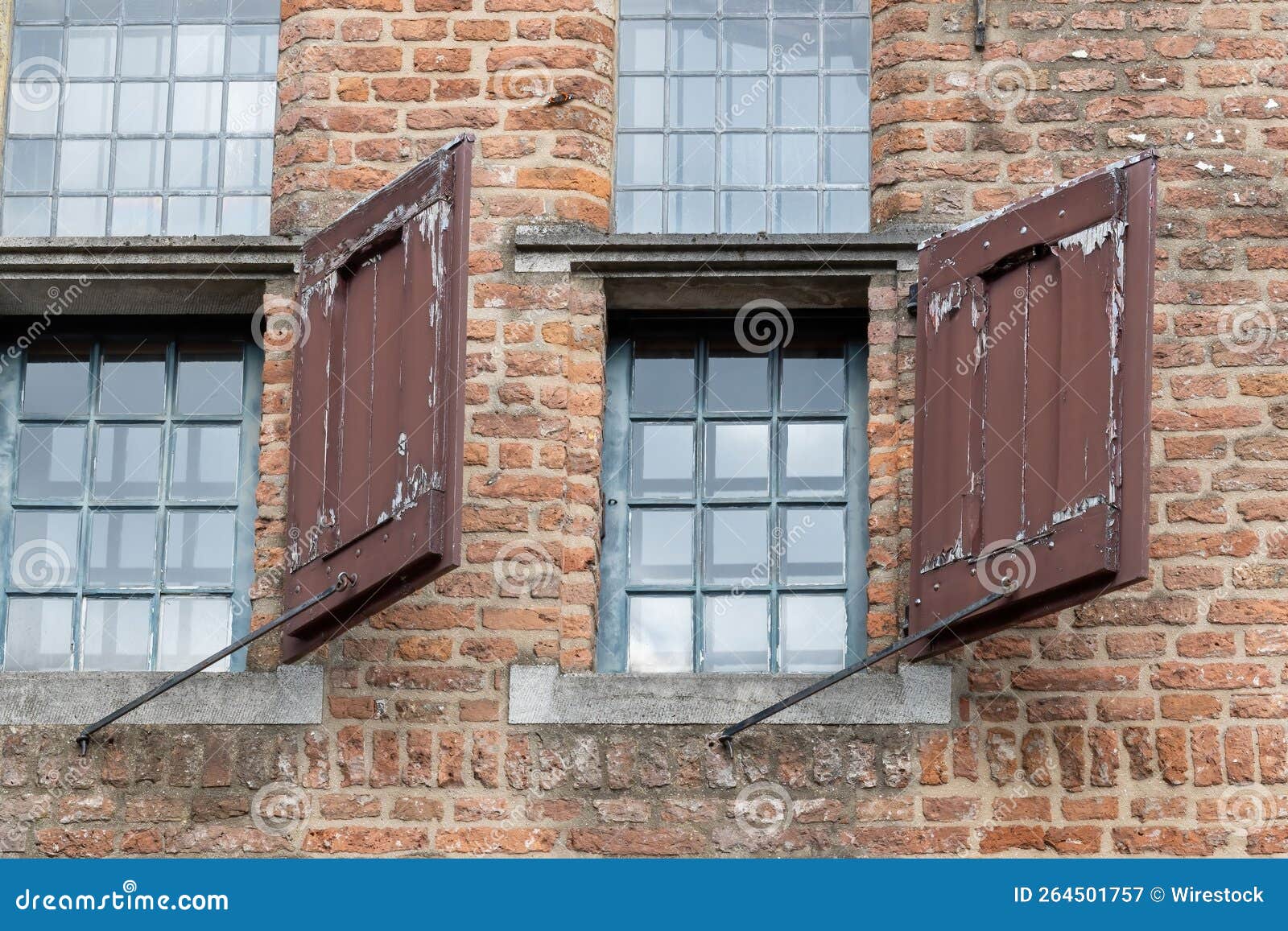 Facade of a Brick Building with Old Windows Stock Image - Image of ...