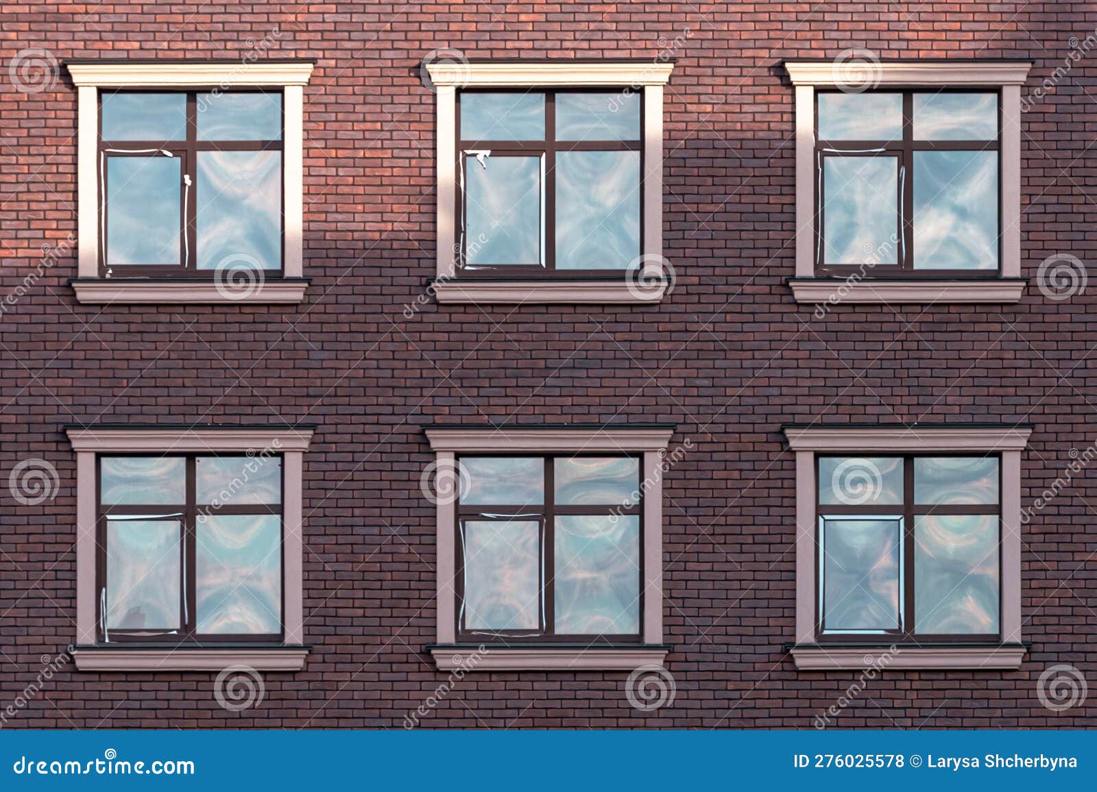 The Facade of a Brick House with Identical Square Windows Stock Photo ...