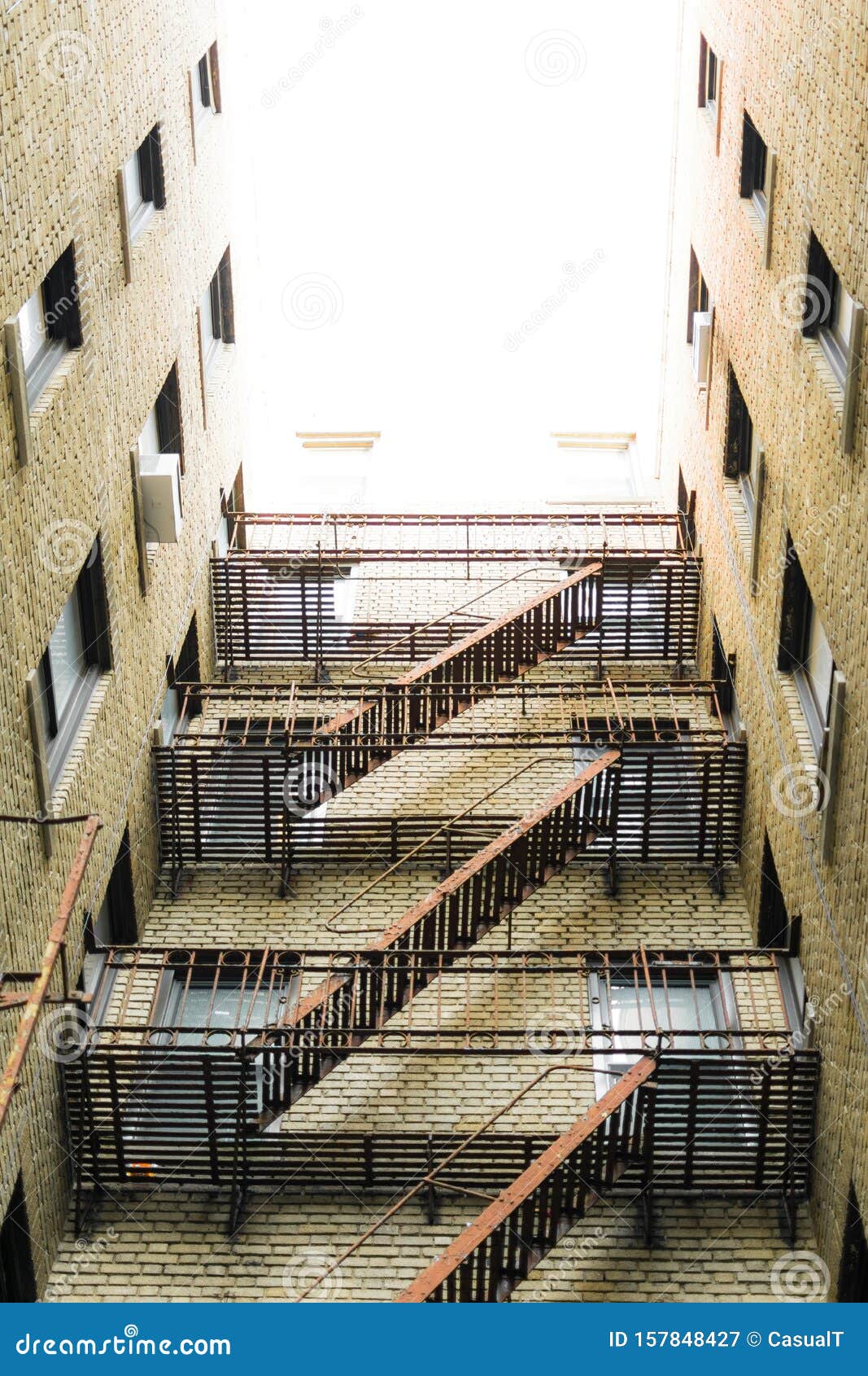 Facade of a Brownstone with Old Rusty Fire Escape Stock Image - Image ...